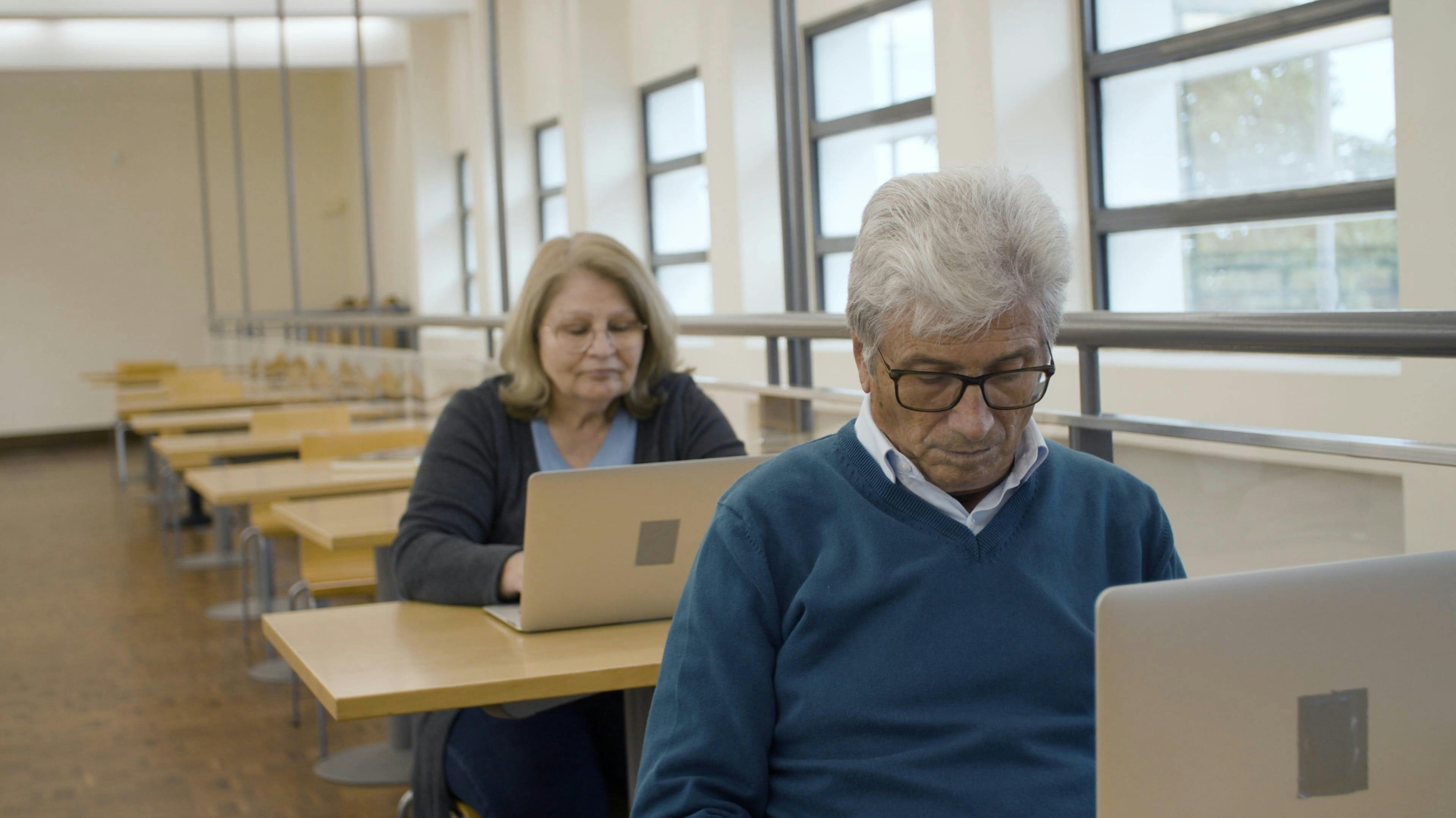 Elderly People in a Computer Skills Learning Class · Free Stock Video