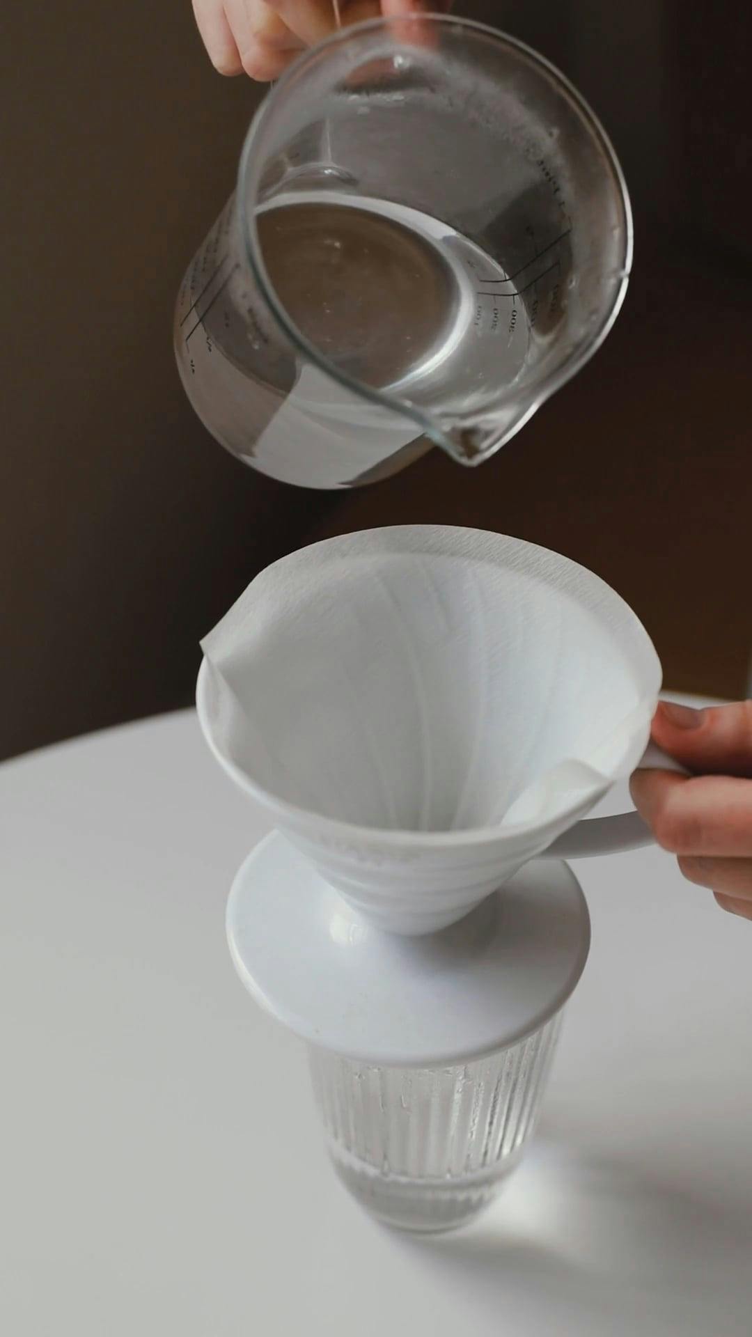 A Person Pouring Water into a Coffee Filter Free Stock Video Footage ...