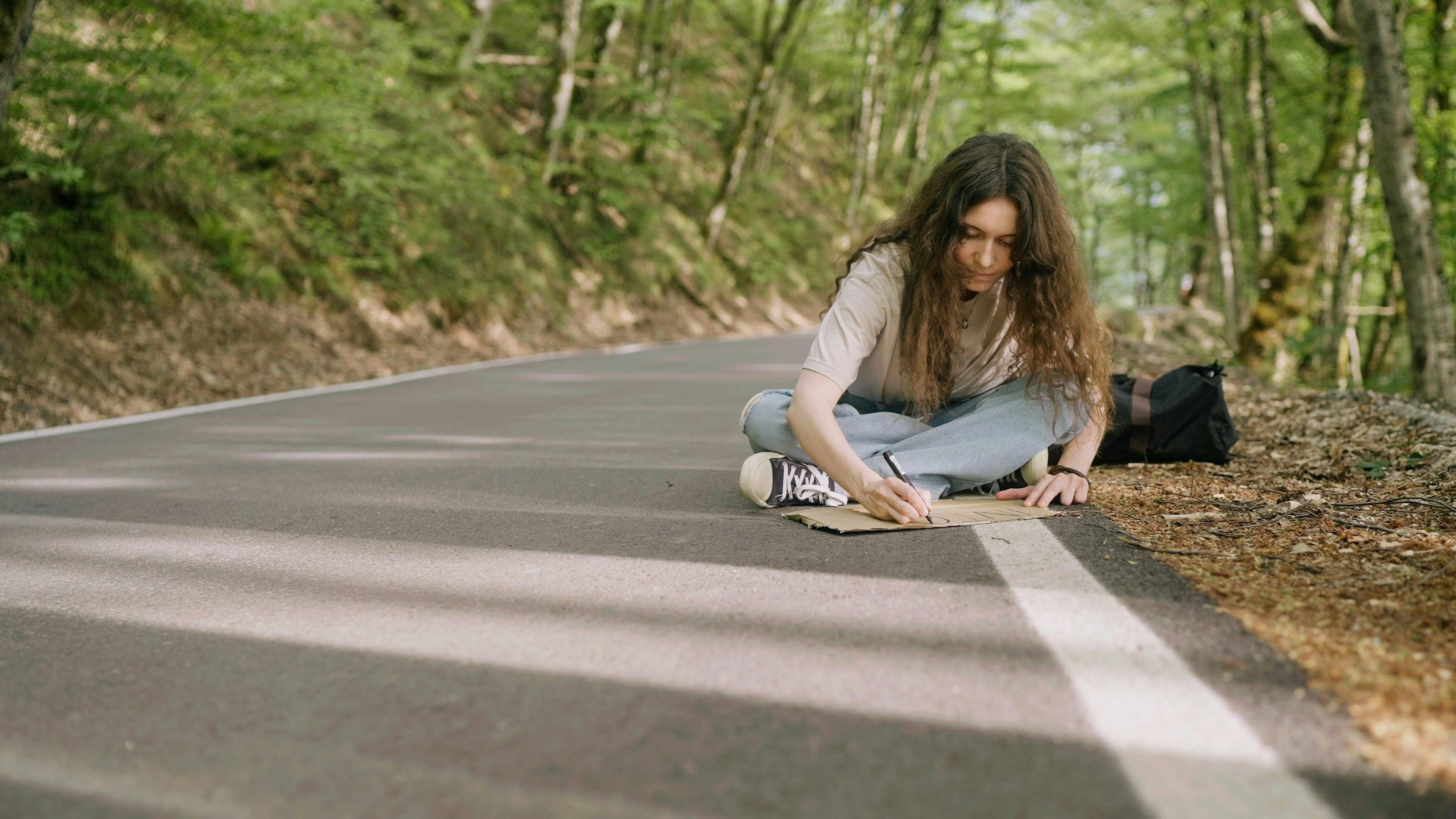 A Woman Writing on a Carton Placard Free Stock Video Footage, Royalty ...