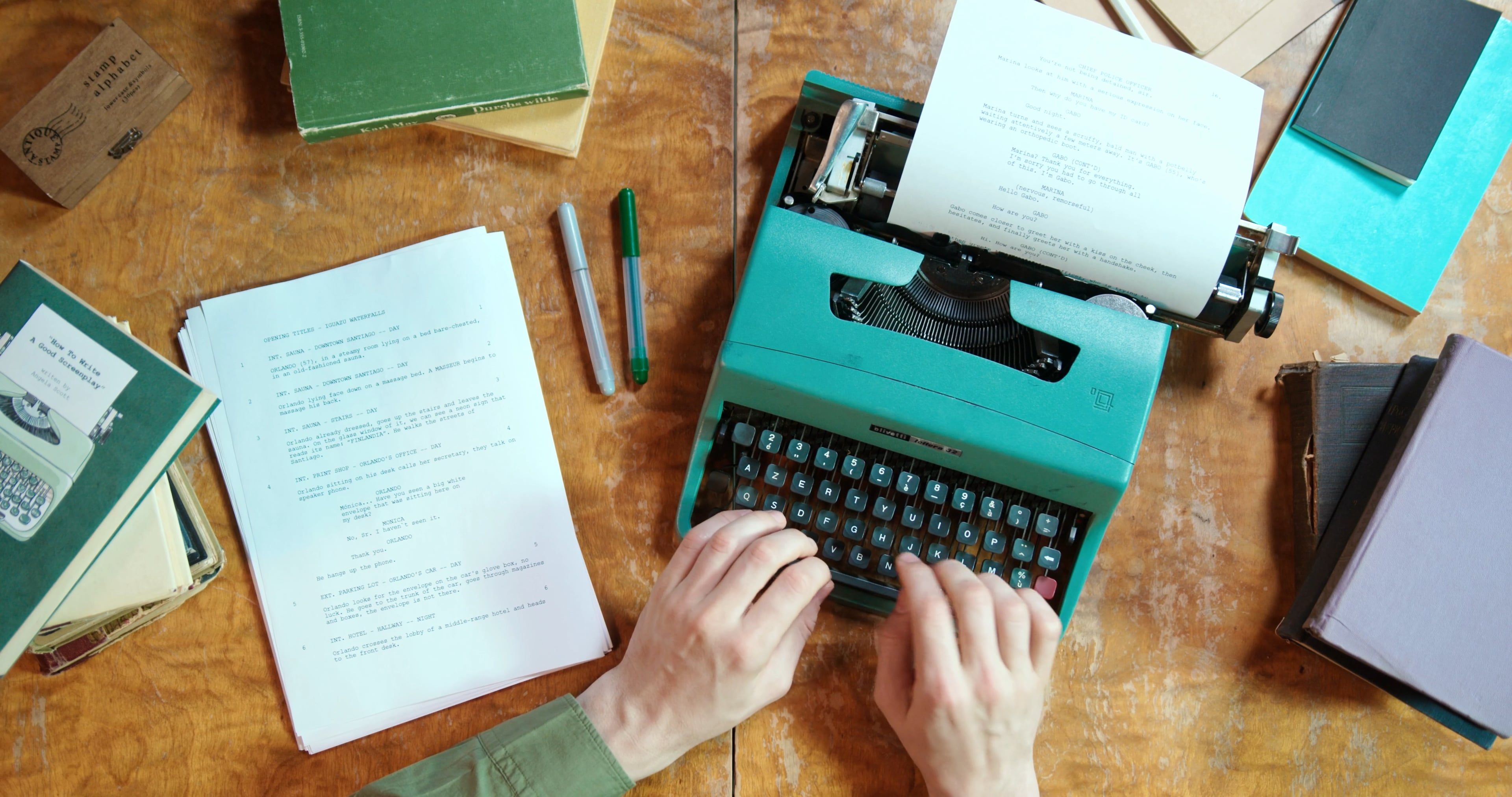High Angle Shot of a Person Typing on a Vintage Typewriter Free Stock ...