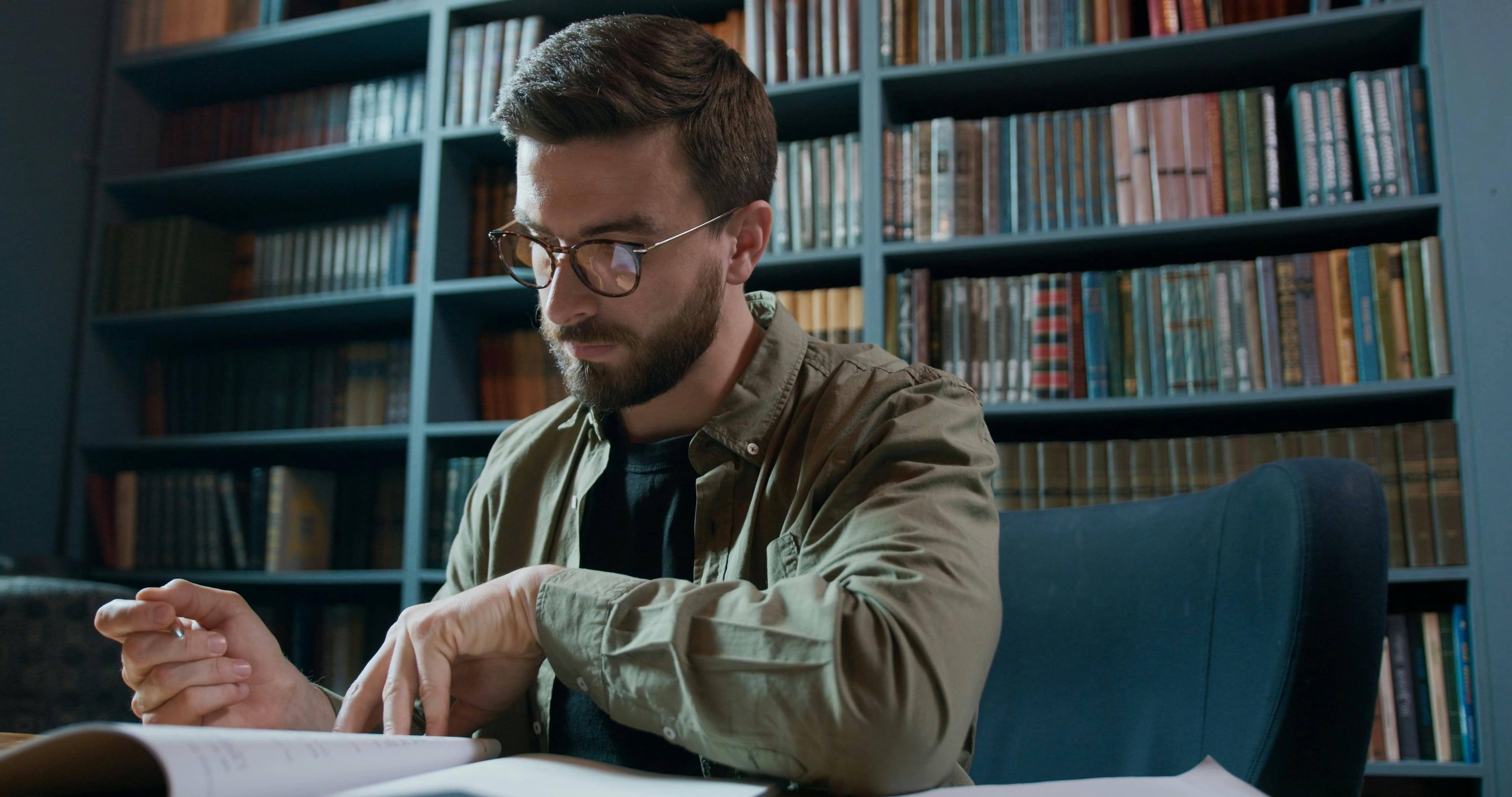 Man Working in a Library · Free Stock Video