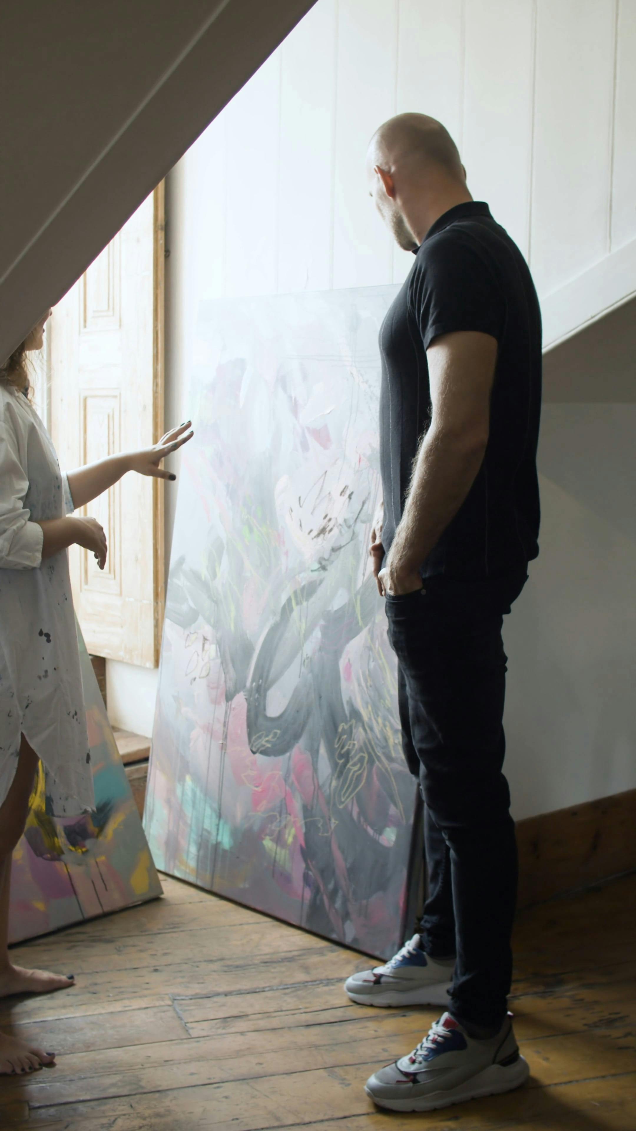 Woman Showing Artwork · Free Stock Video