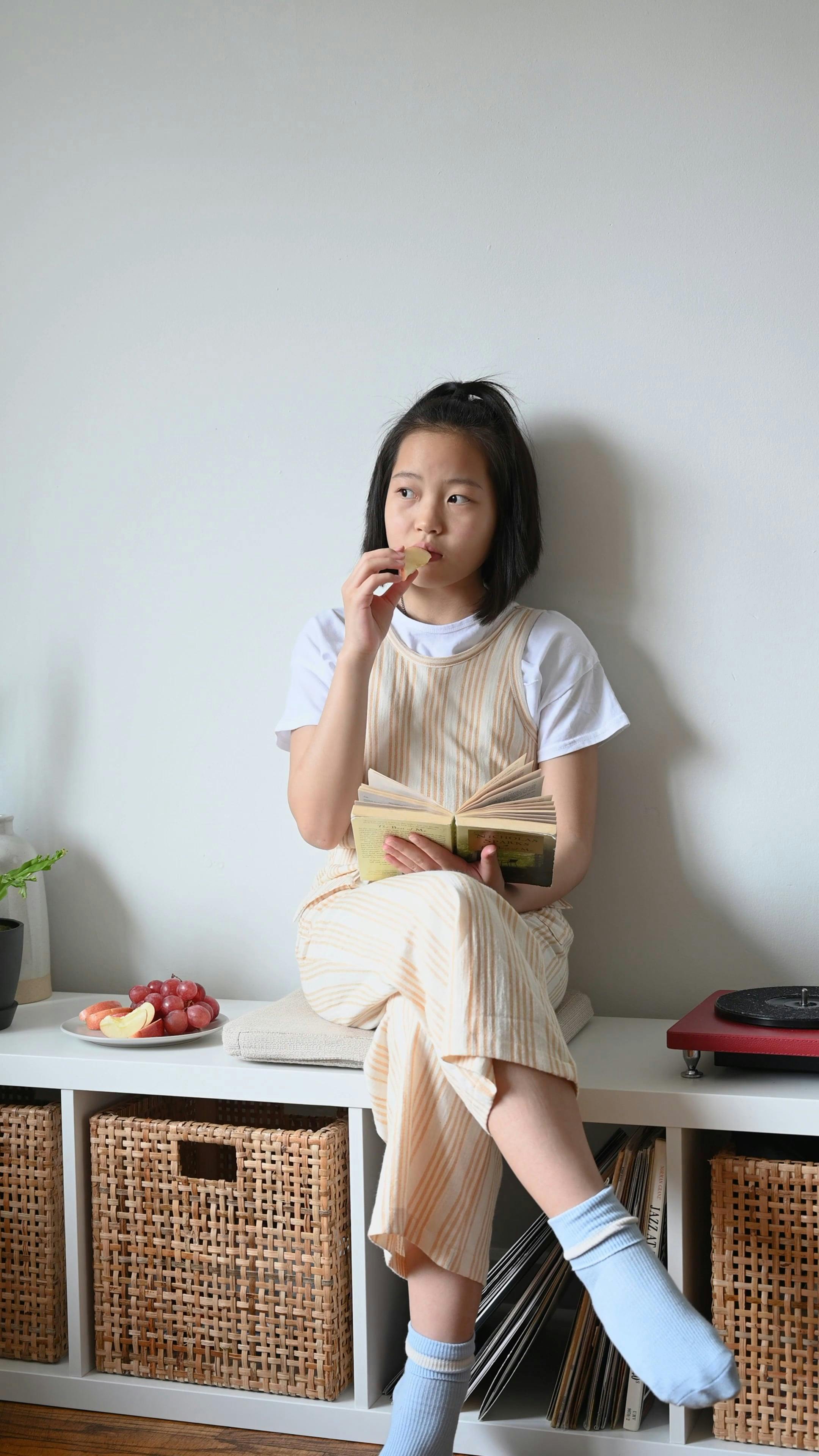 Girl is Eating while Reading a Book Free Stock Video Footage, Royalty ...