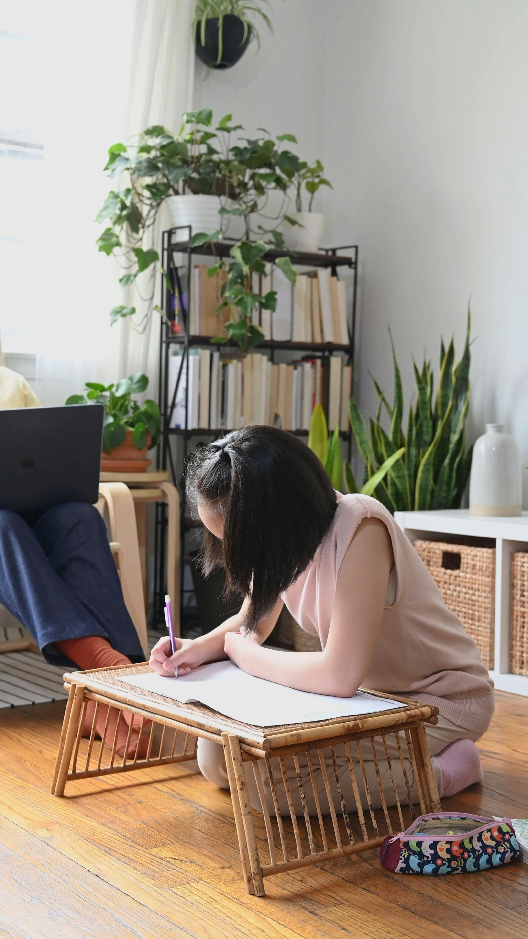 Girl Writing In A White Paper · Free Stock Video