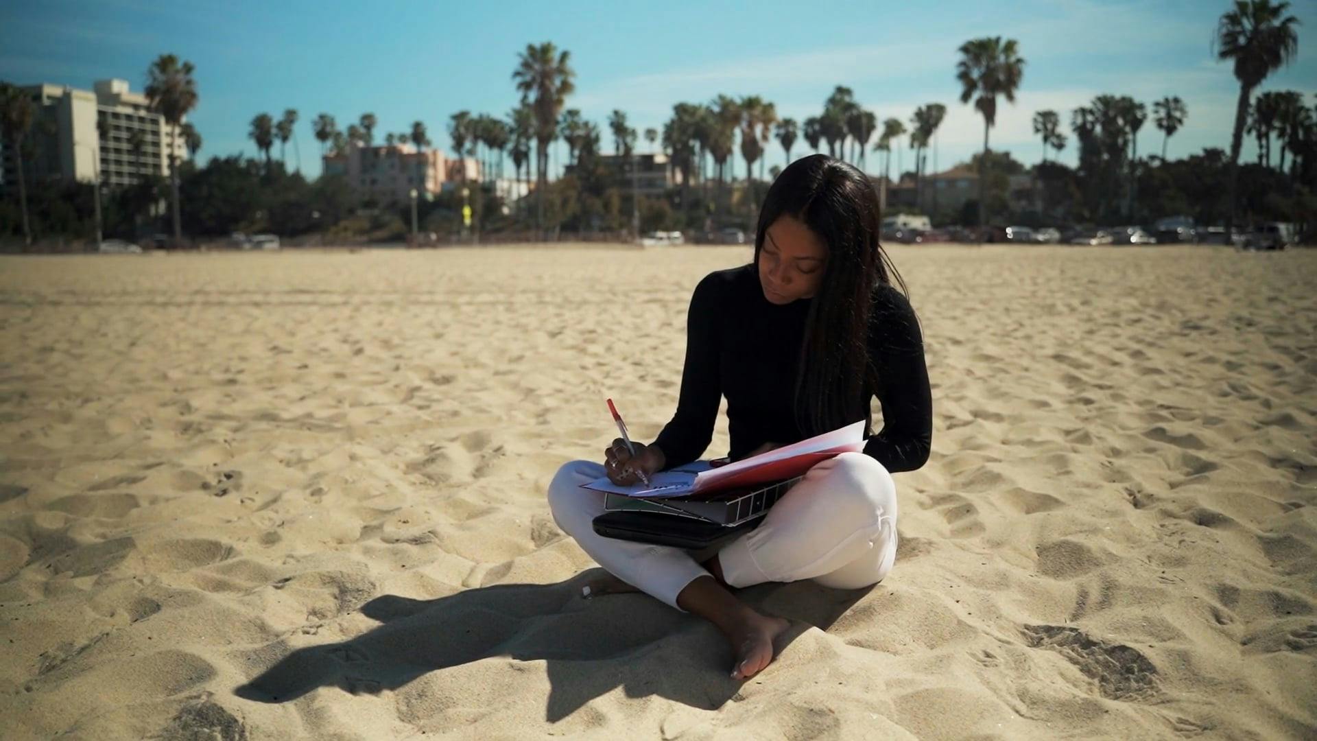 Woman Writing on Paper While Sitting on the Beach Free Stock Video ...