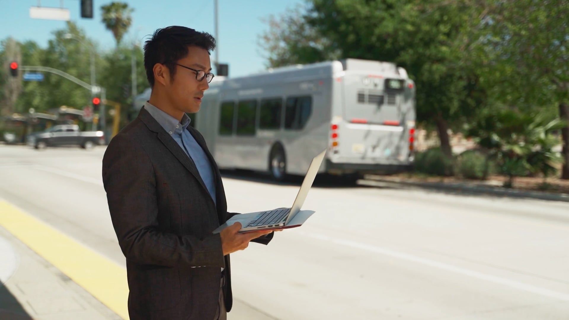A Man Using Laptop While Standing Outdoors Free Stock Video Footage ...