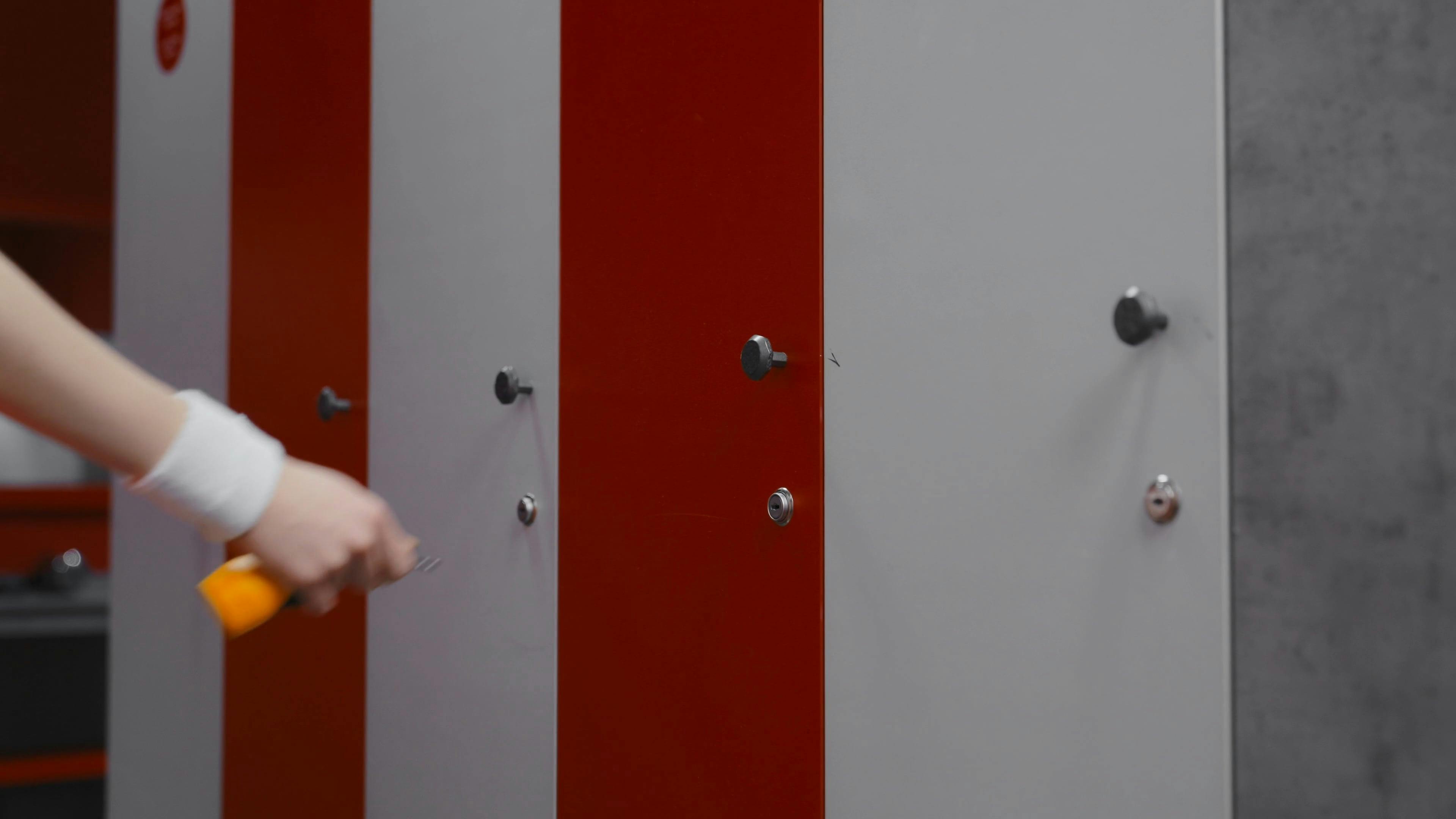 Person Opening a Locker with Key · Free Stock Video