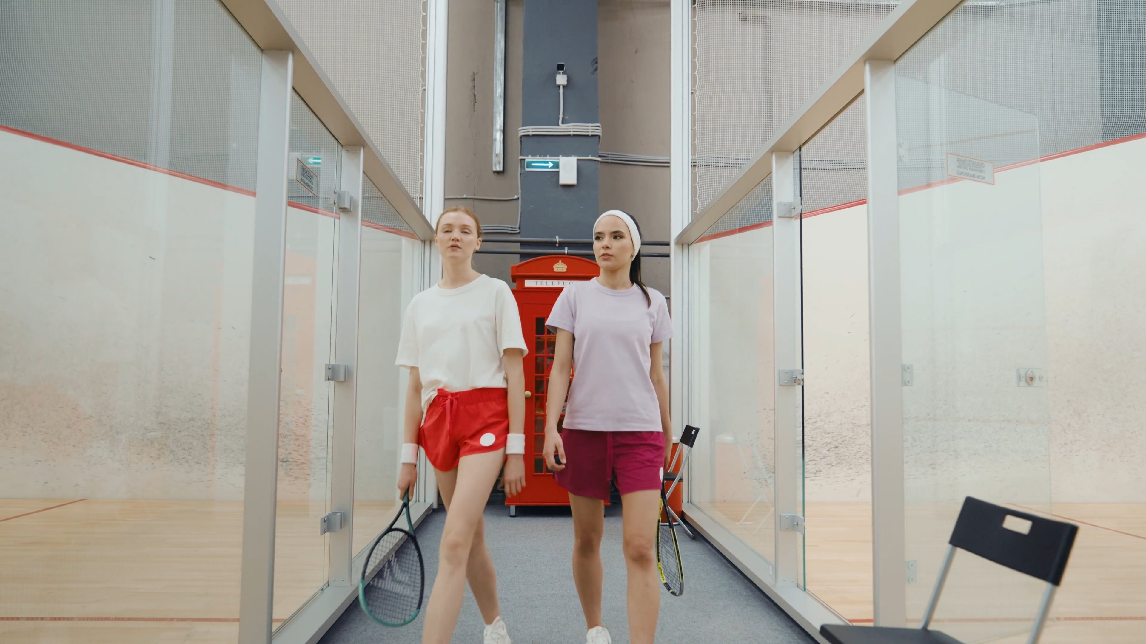 Two Women Walking while holding Tennis Rackets Free Stock Video Footage ...