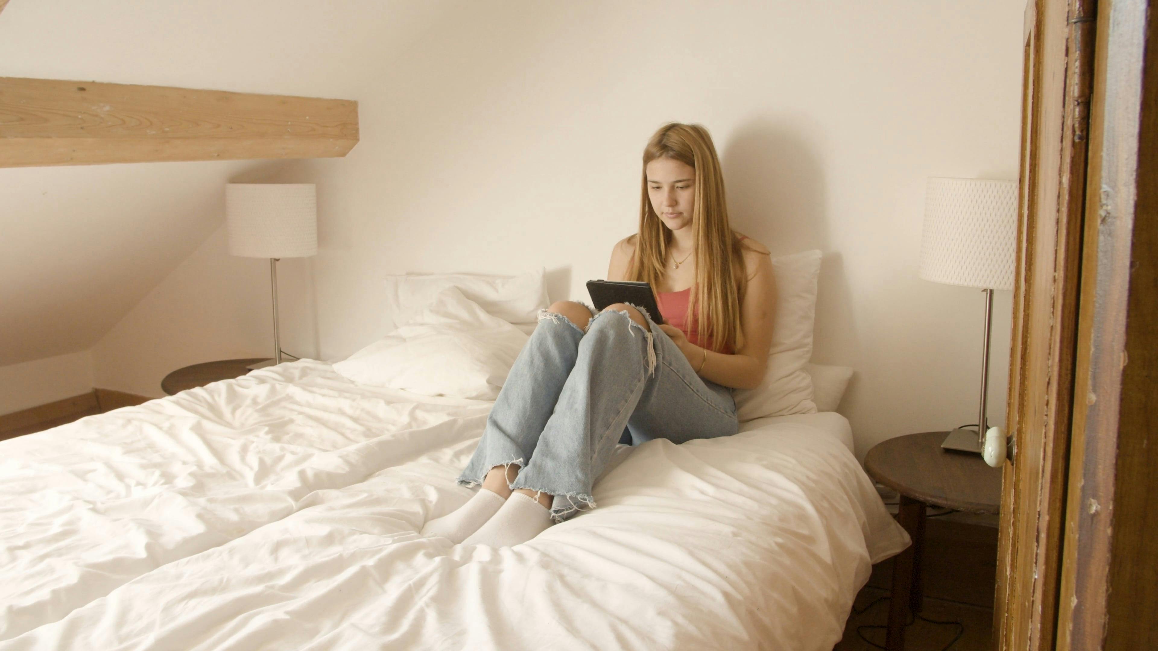 Woman Browsing on her Digital Tablet · Free Stock Video