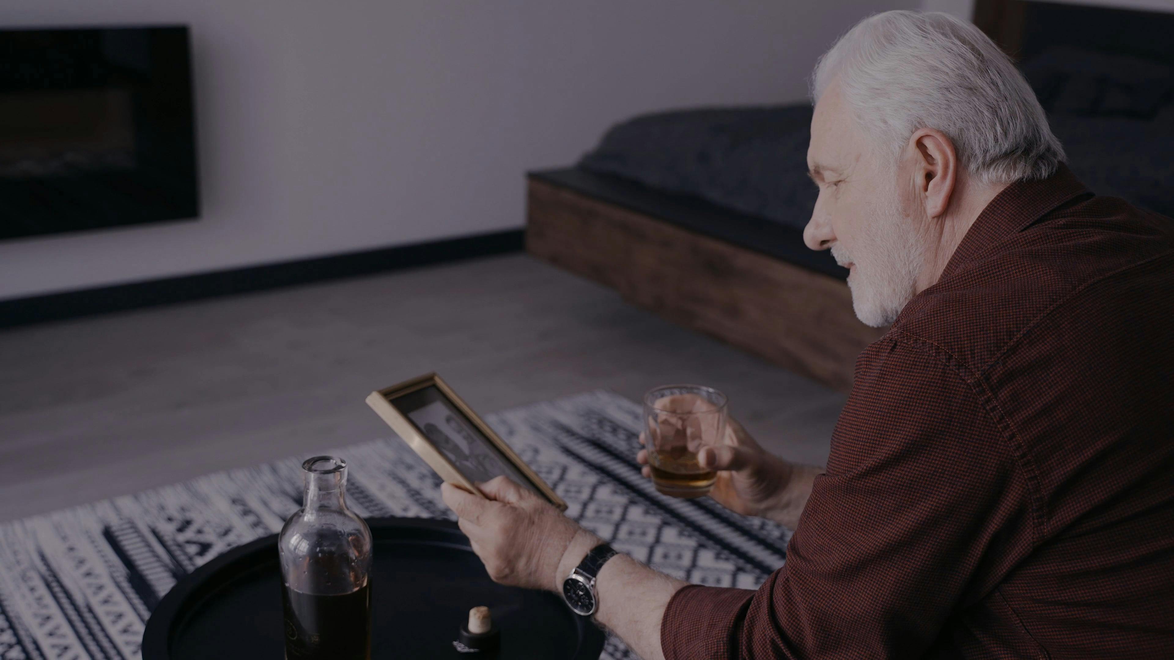 An Old Man Looking at a Pictures · Free Stock Video