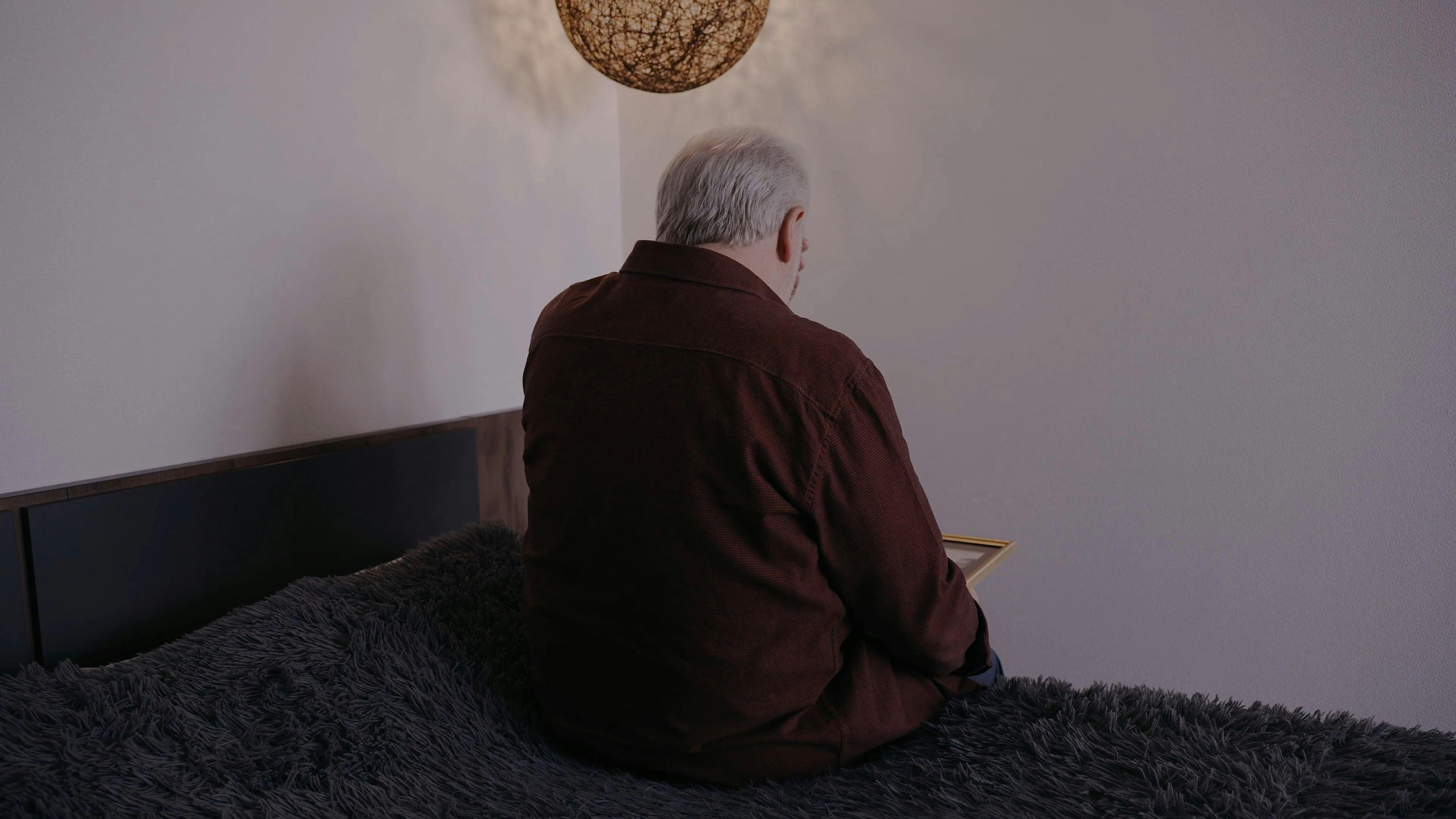 Elderly Man Grieving while Looking at the Photo · Free Stock Video