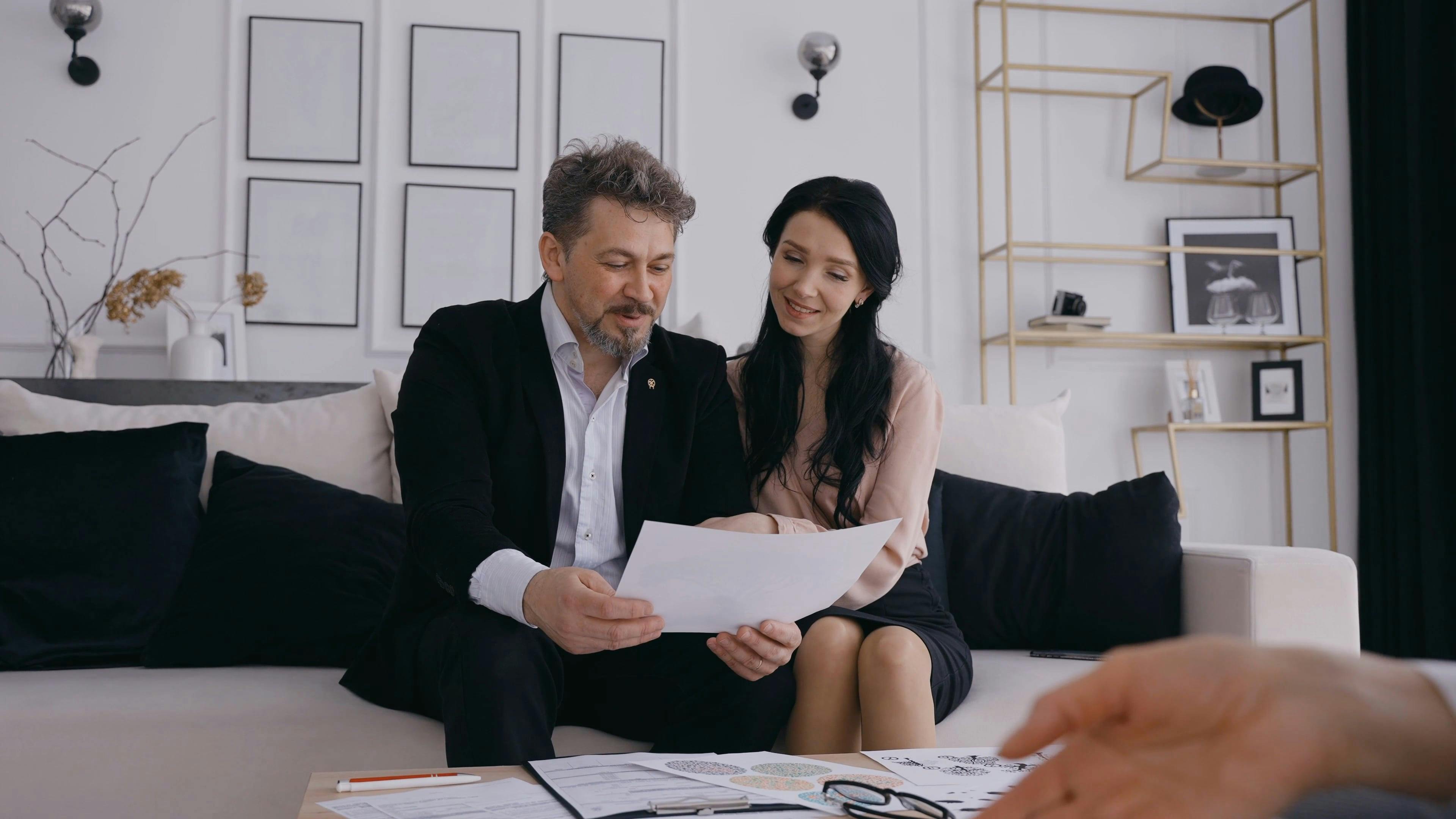Close-up Footage of a Couple Reading a Document · Free Stock Video