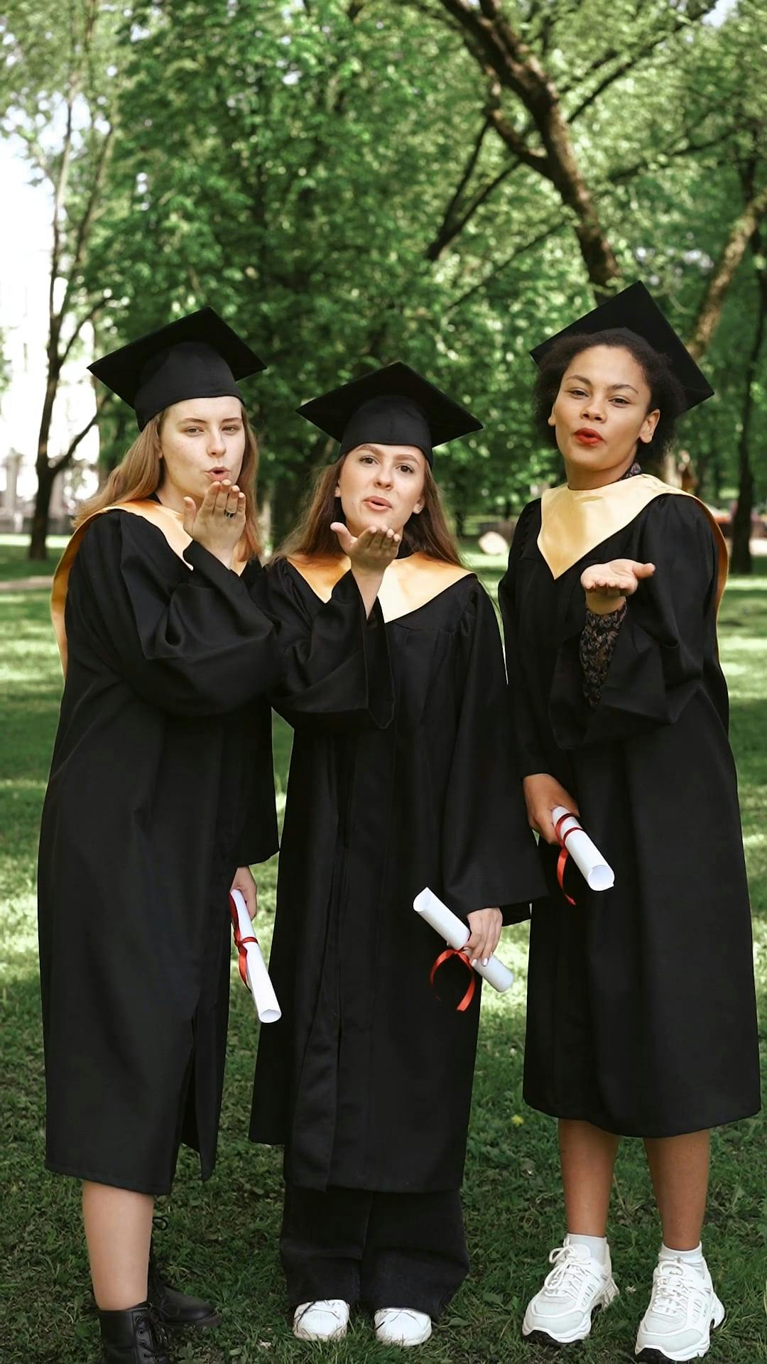 Female Graduates Doing a Flying Kiss Pose Free Stock Video Footage ...