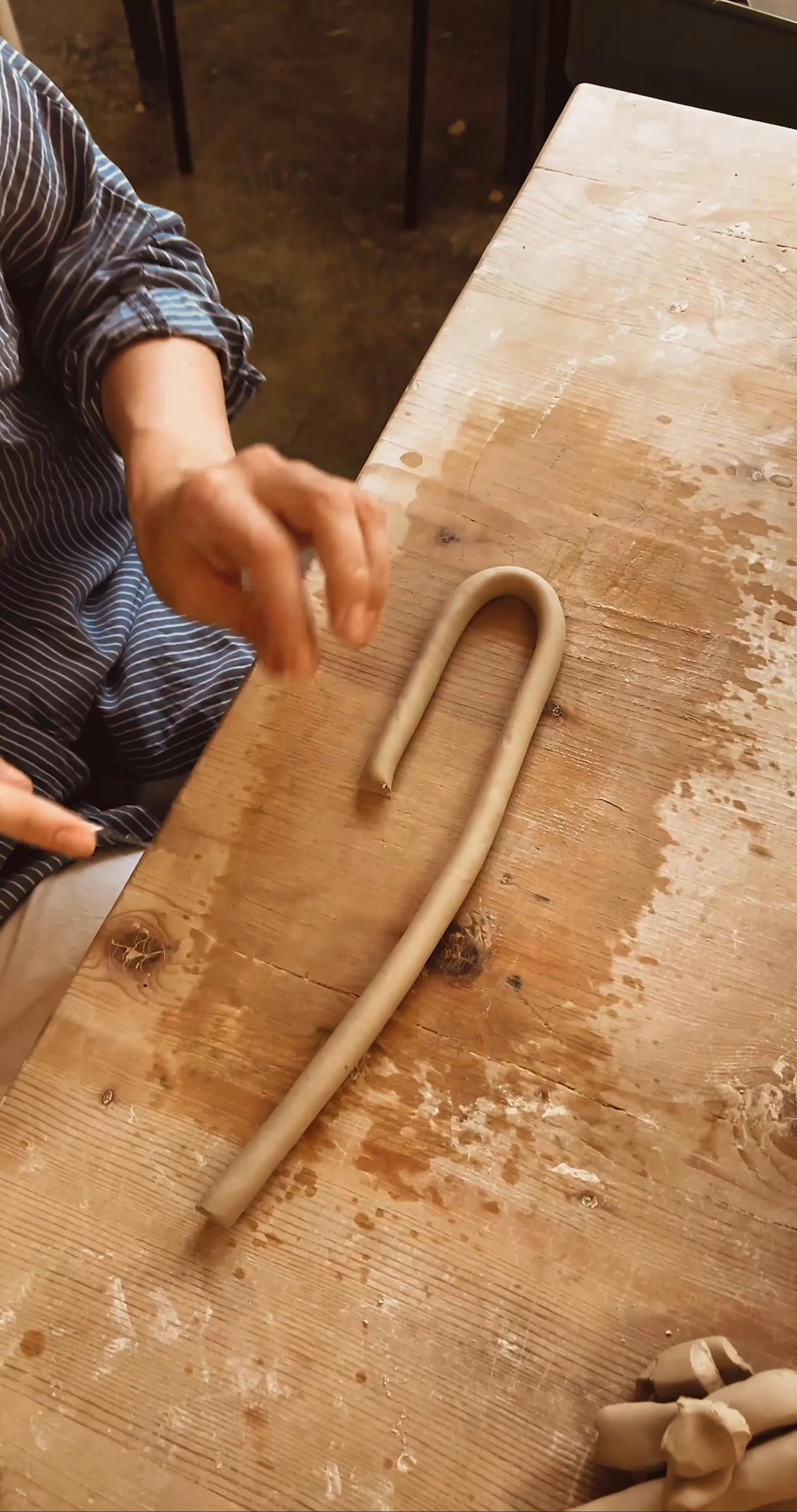 Person Slicing Mold Of Clay · Free Stock Video