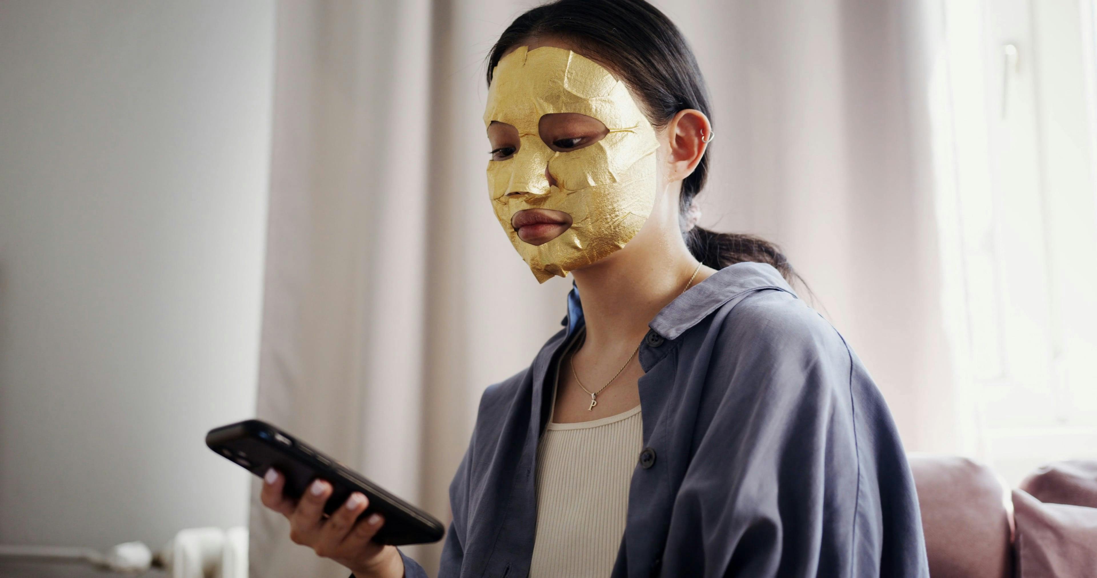Woman Wearing Face Mask While Using A Mobile Phone · Free Stock Video