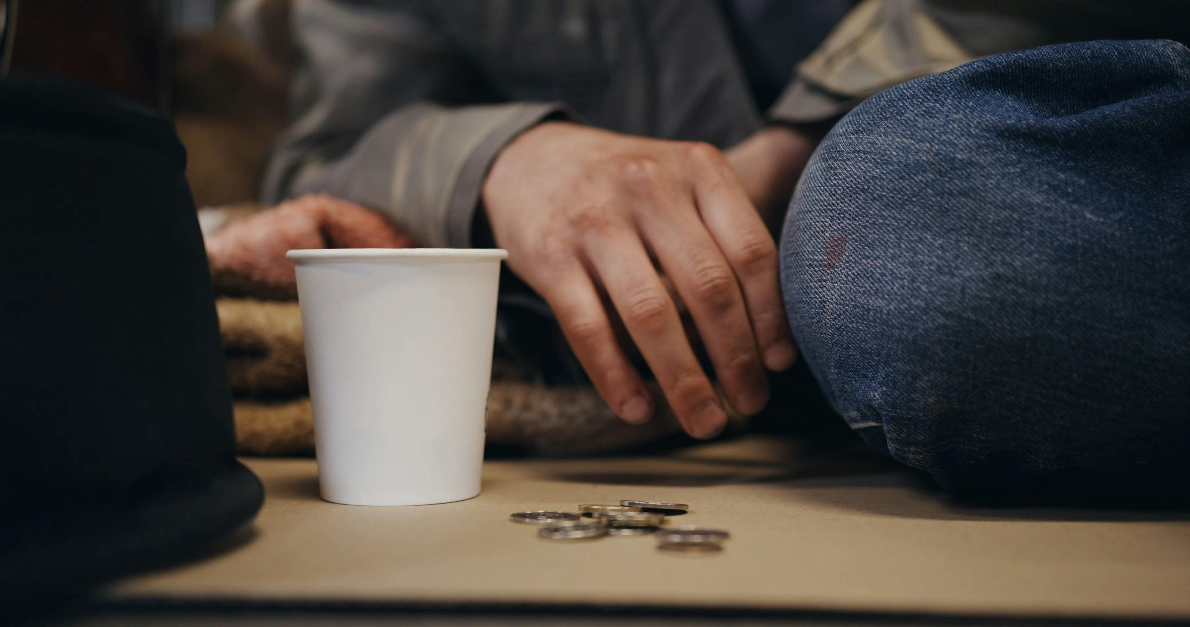 Close up of a Homeless Person Counting Coins · Free Stock Video