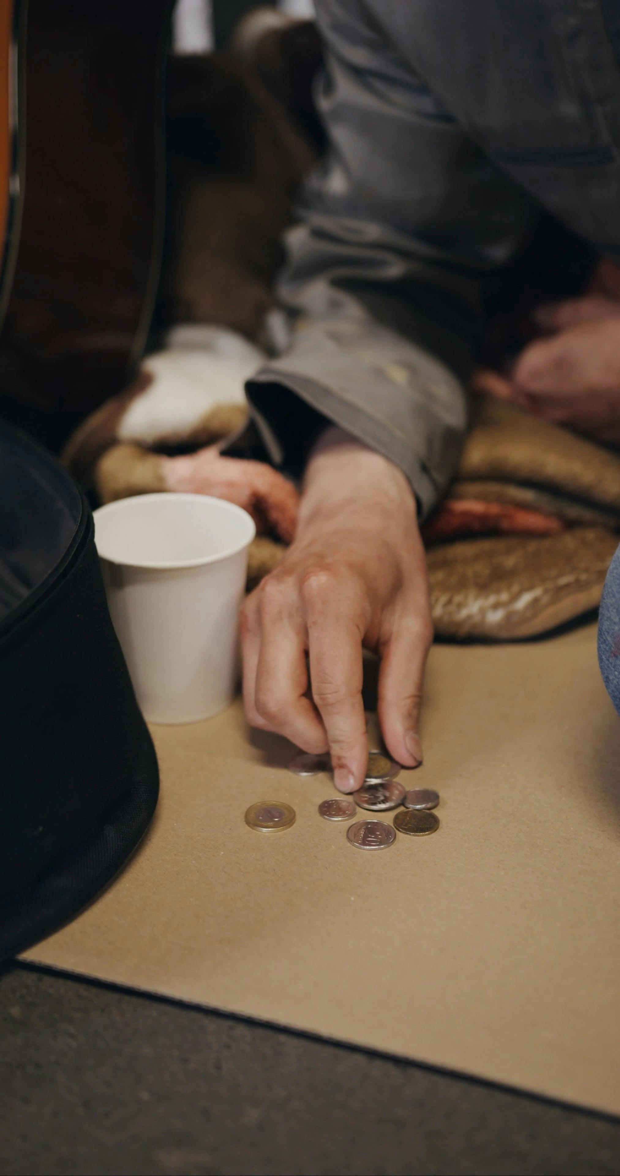 A Homeless Person Counting Coins Free Stock Video Footage, Royalty-Free ...