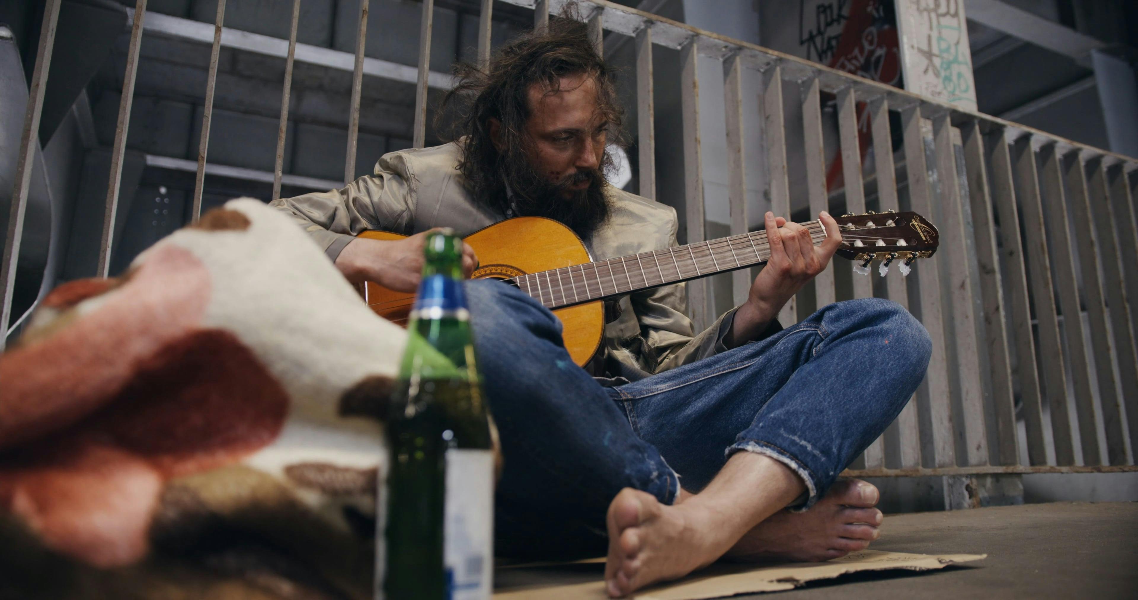 A Homeless Man Playing the Guitar · Free Stock Video