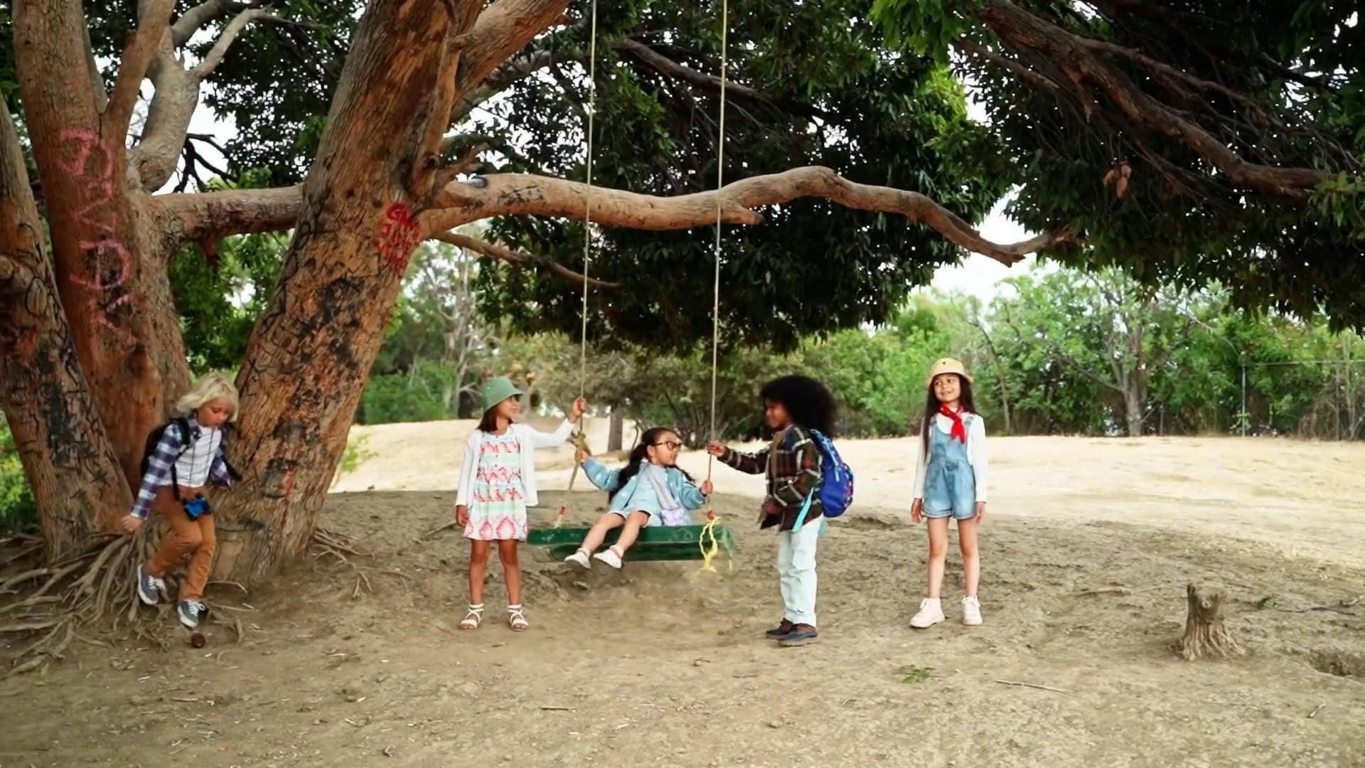 Children Walking On A Paved Pathway With Their Backpacks Free Stock ...