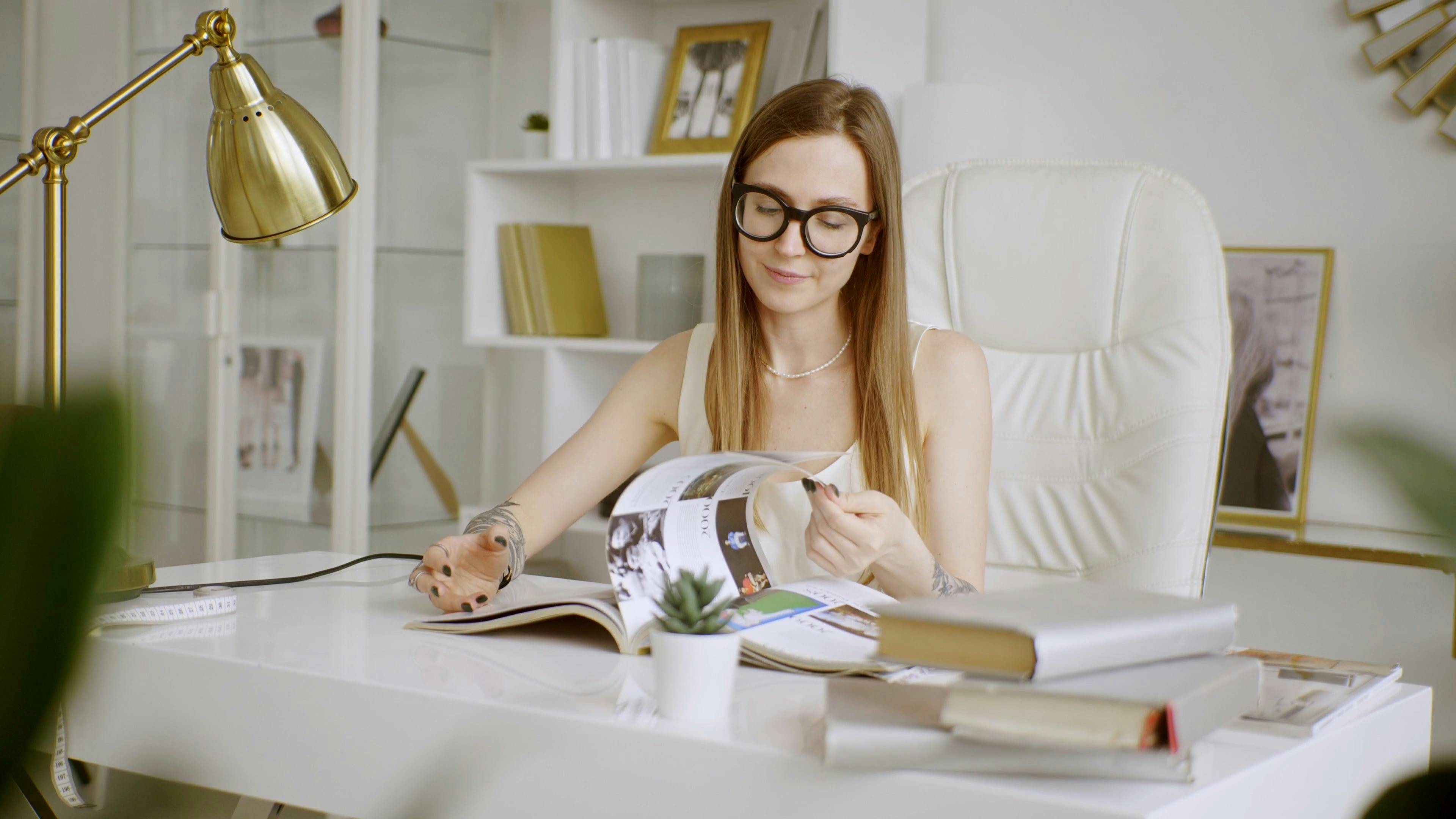 A Woman Browsing a Magazine Free Stock Video Footage, Royalty-Free 4K ...