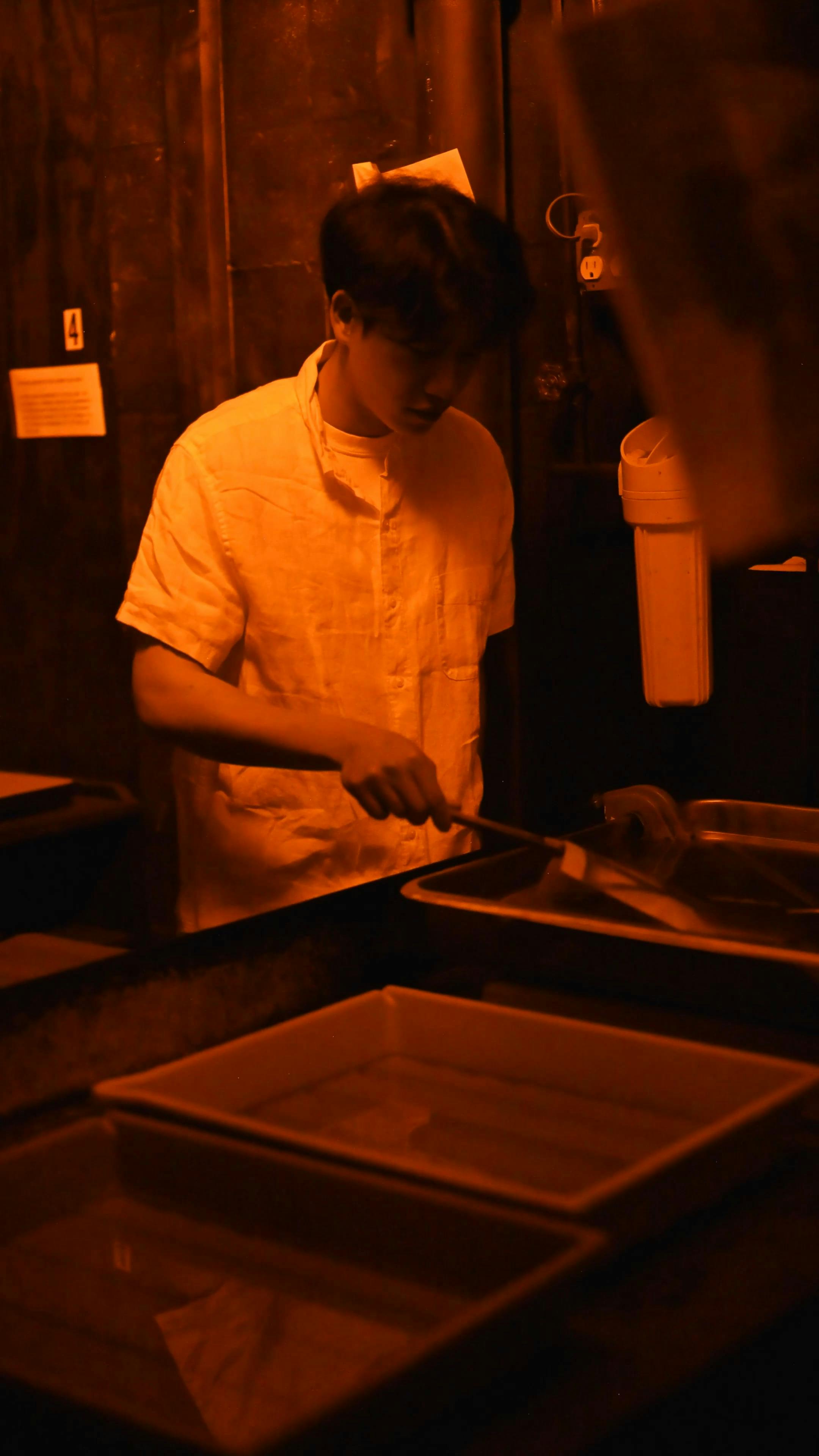 A Photographer Soaking Pictures to Chemical Free Stock Video Footage ...