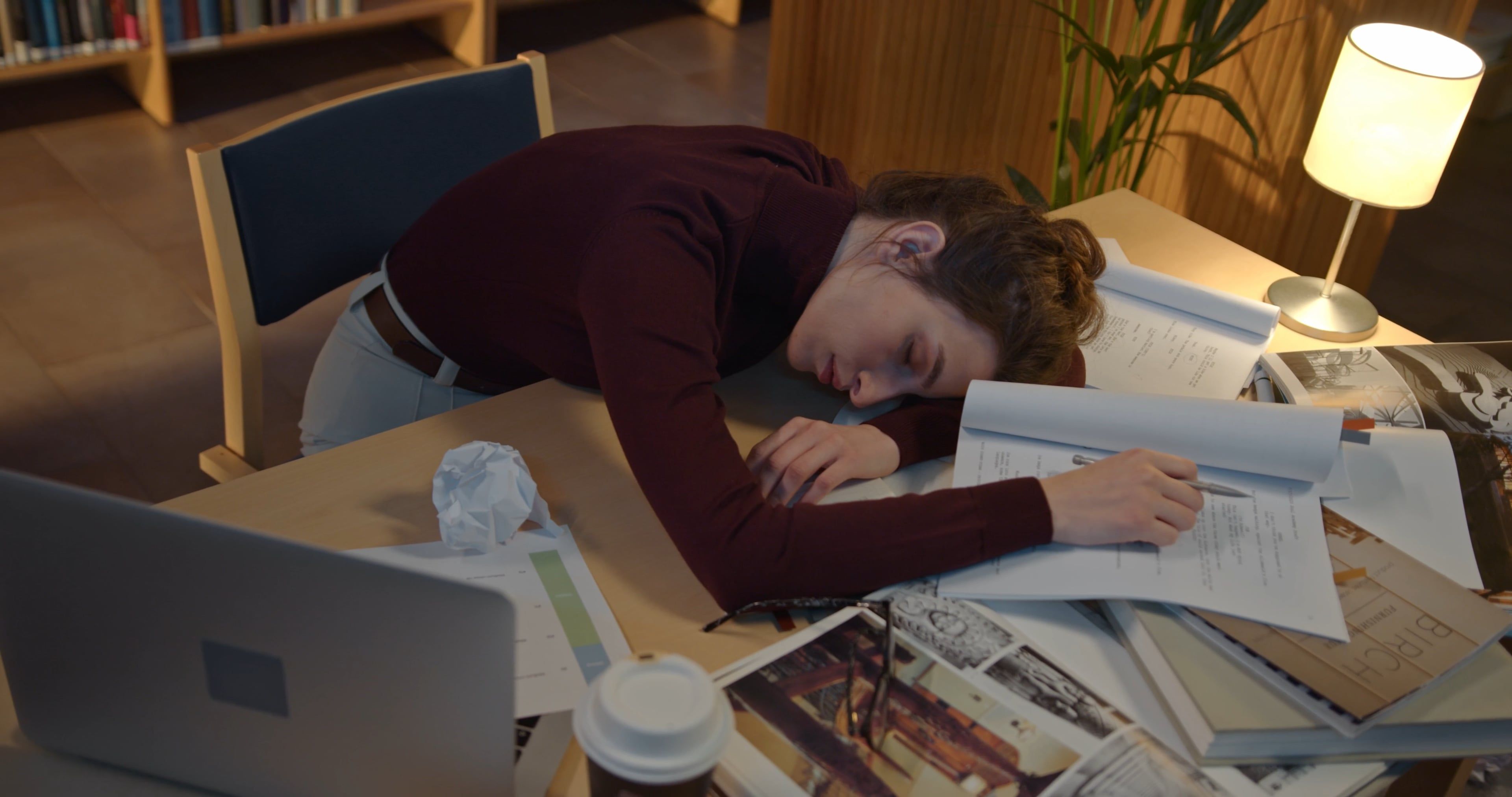 Woman Sleeping On a Table · Free Stock Video