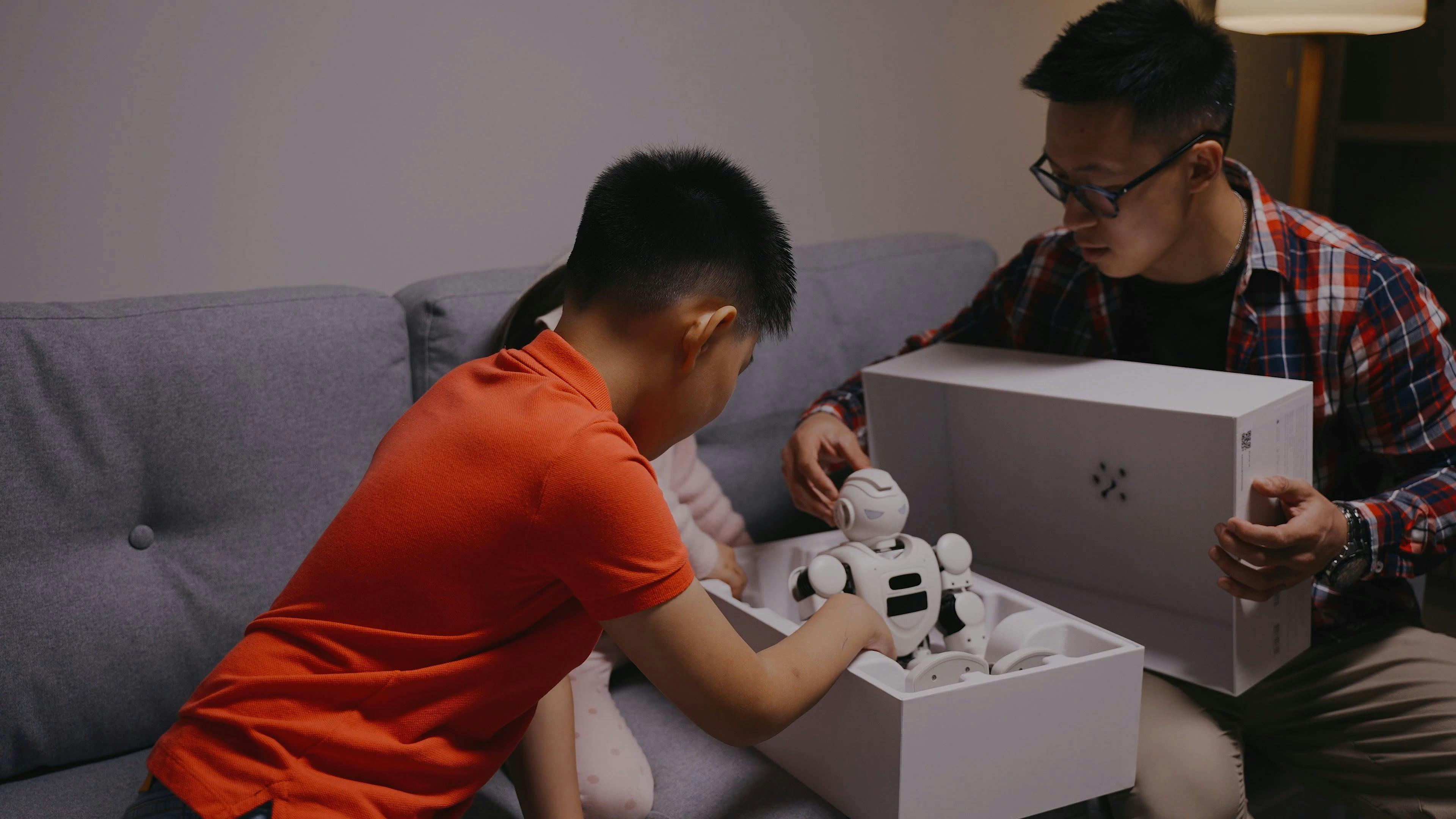 Children Unboxing a Toy Robot with their Dad Free Stock Video Footage ...