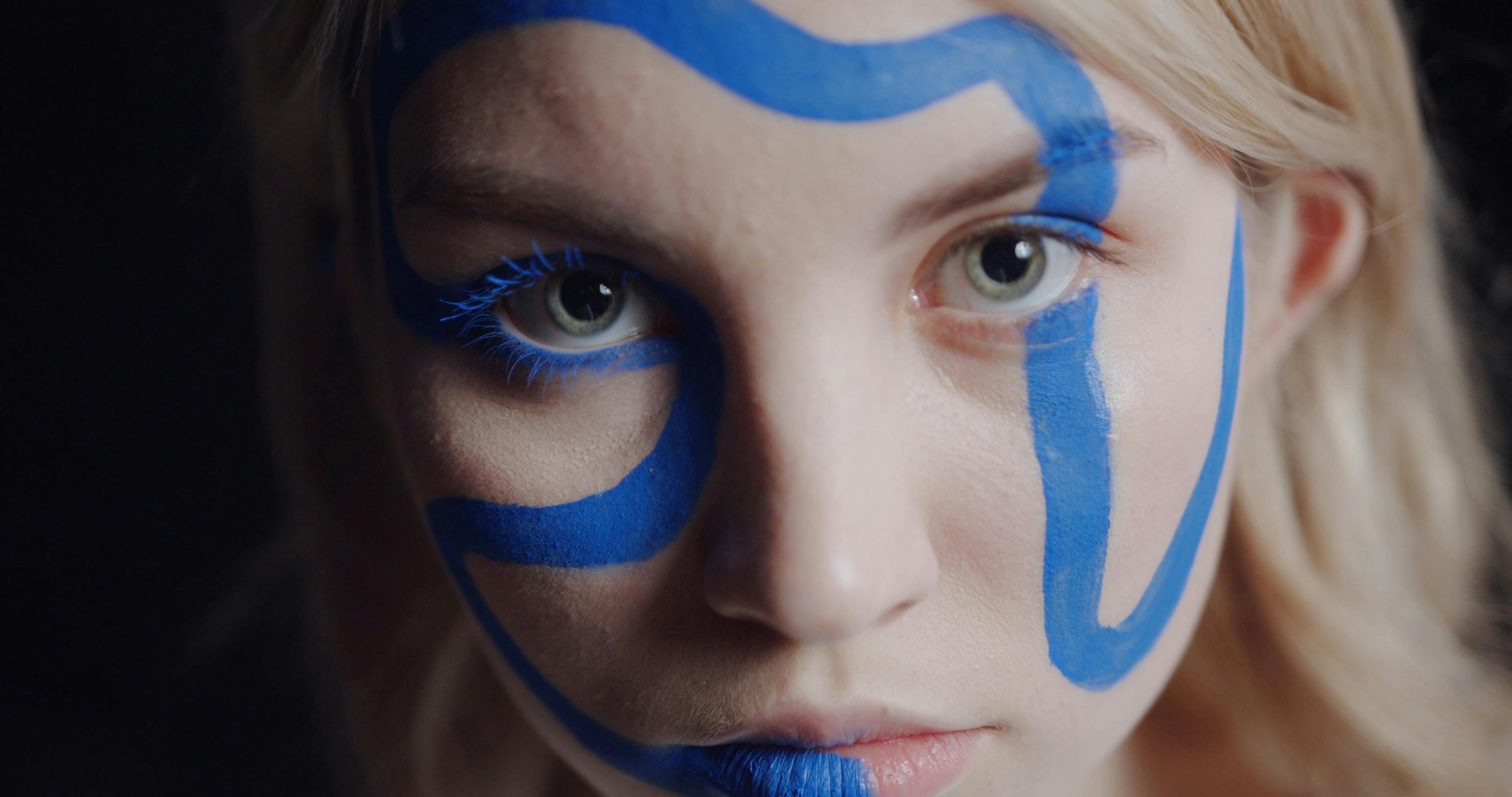 Close-Up Video of Woman in Blue Face Paint · Free Stock Video