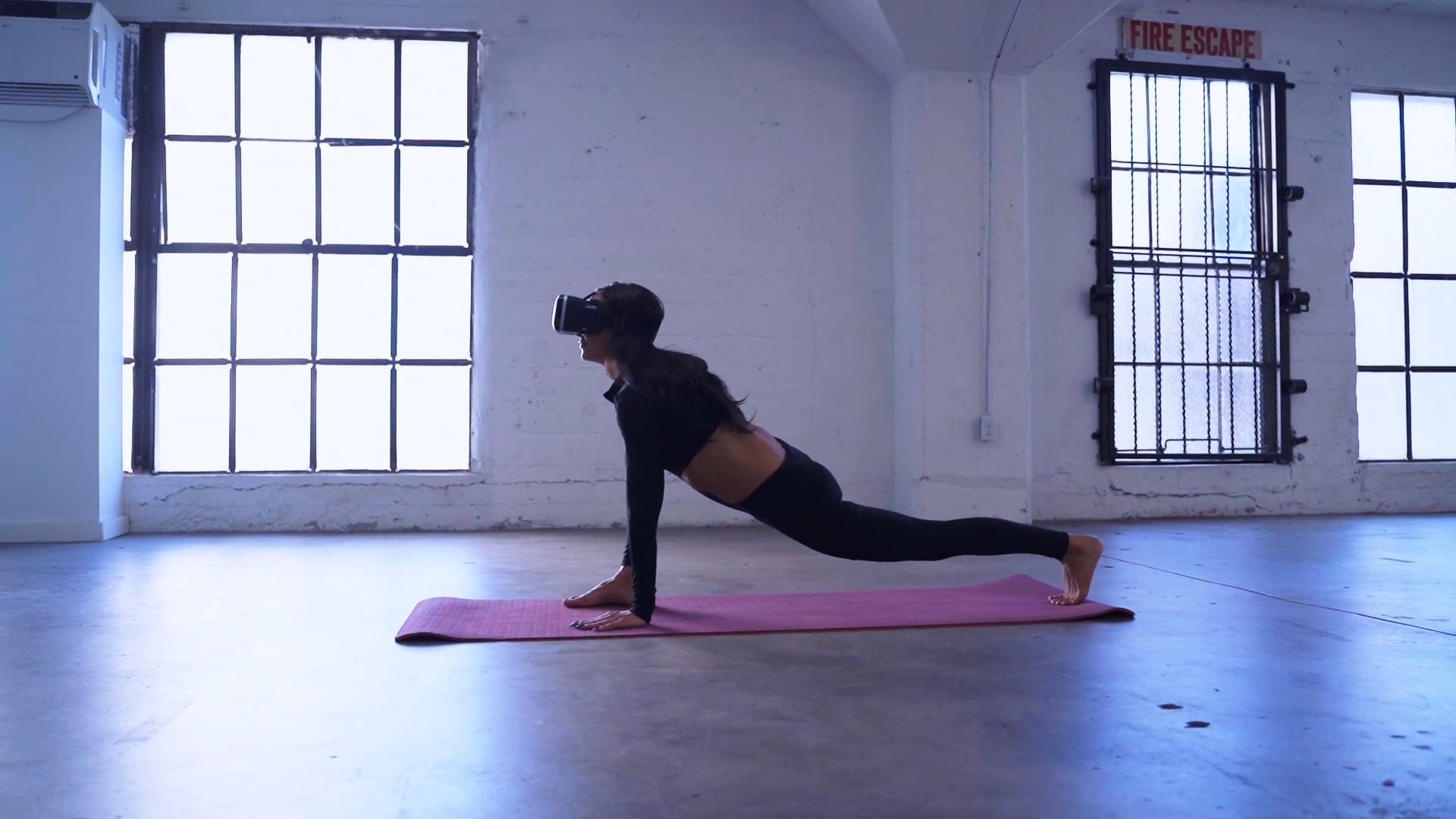 Woman Doing Yoga while Wearing a Virtual Reality Headset Free Stock ...