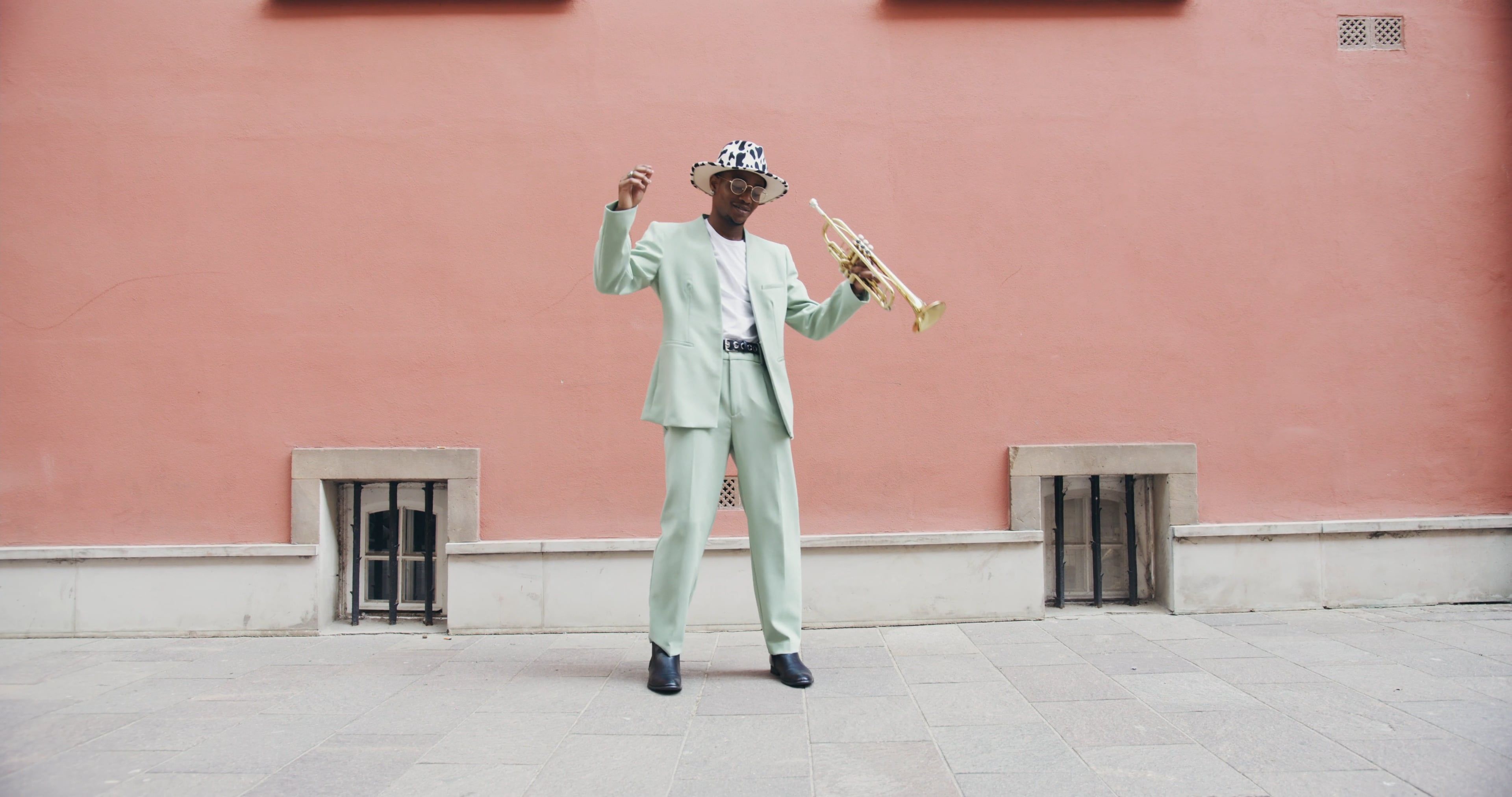 Man Dancing While Holding a Trumpet · Free Stock Video