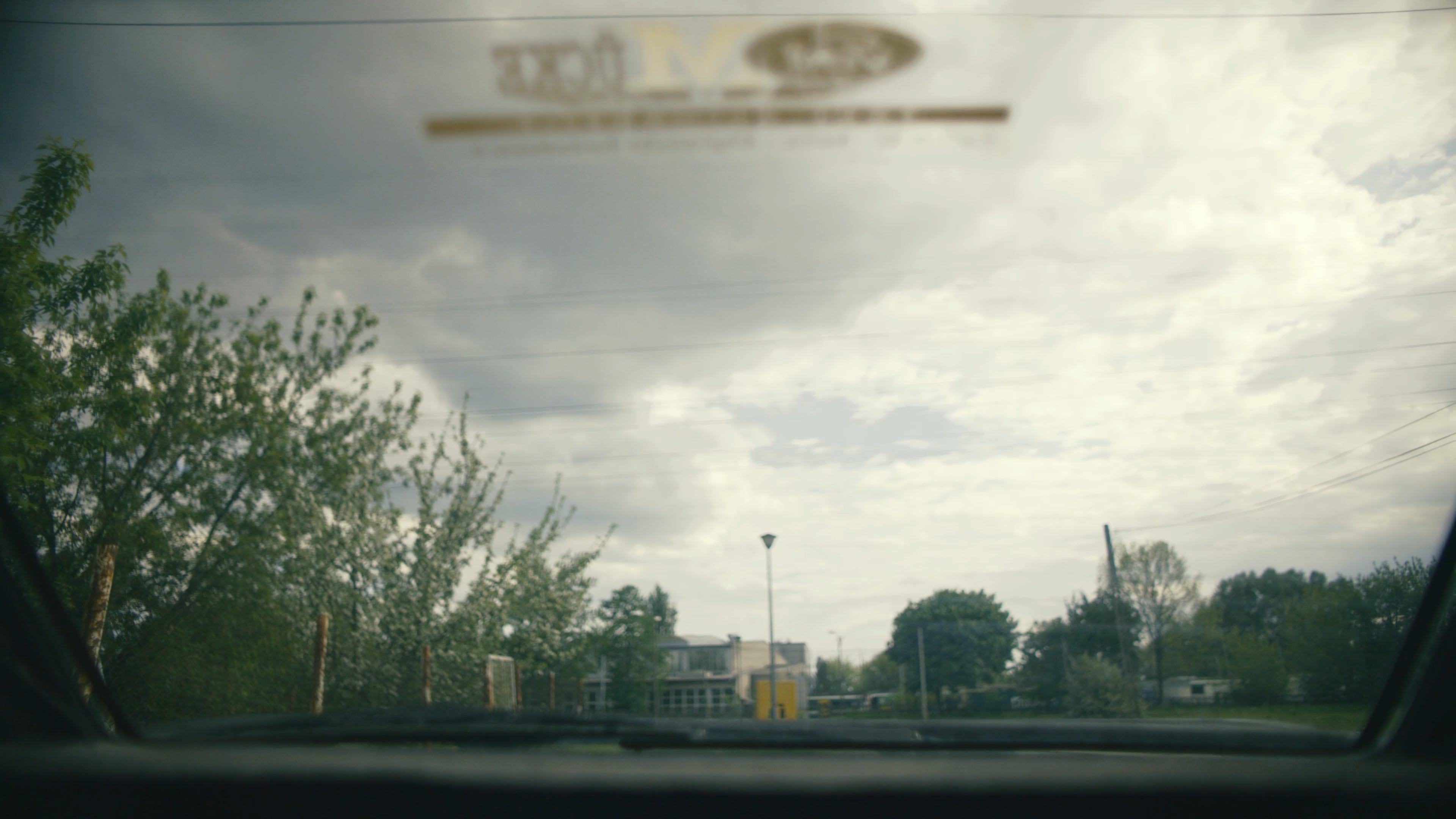 A Couple Looking Around While Opening the Trunk of a Car Free Stock ...