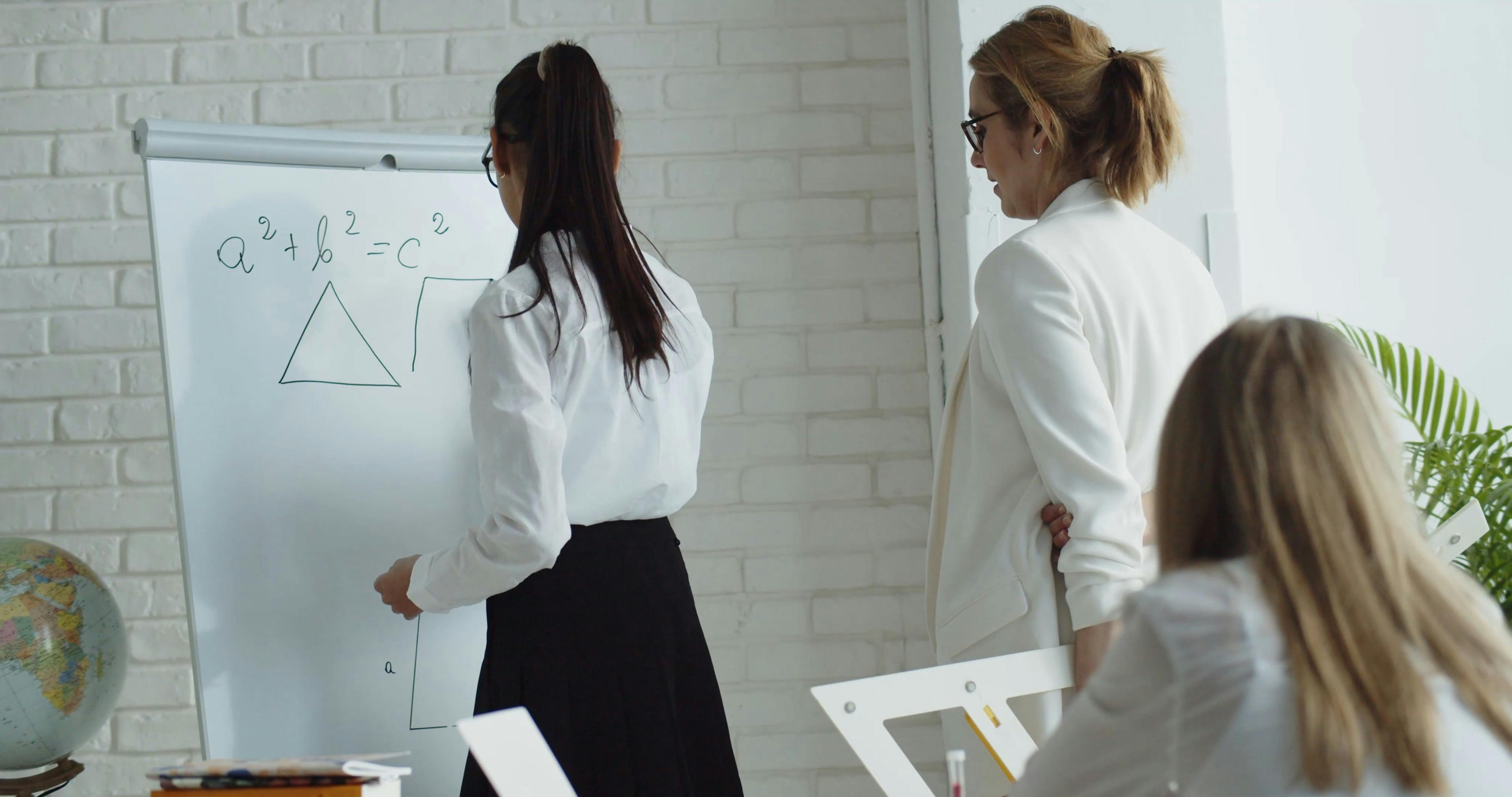 A Student Solving A Math Equation On The Blackboard · Free Stock Video