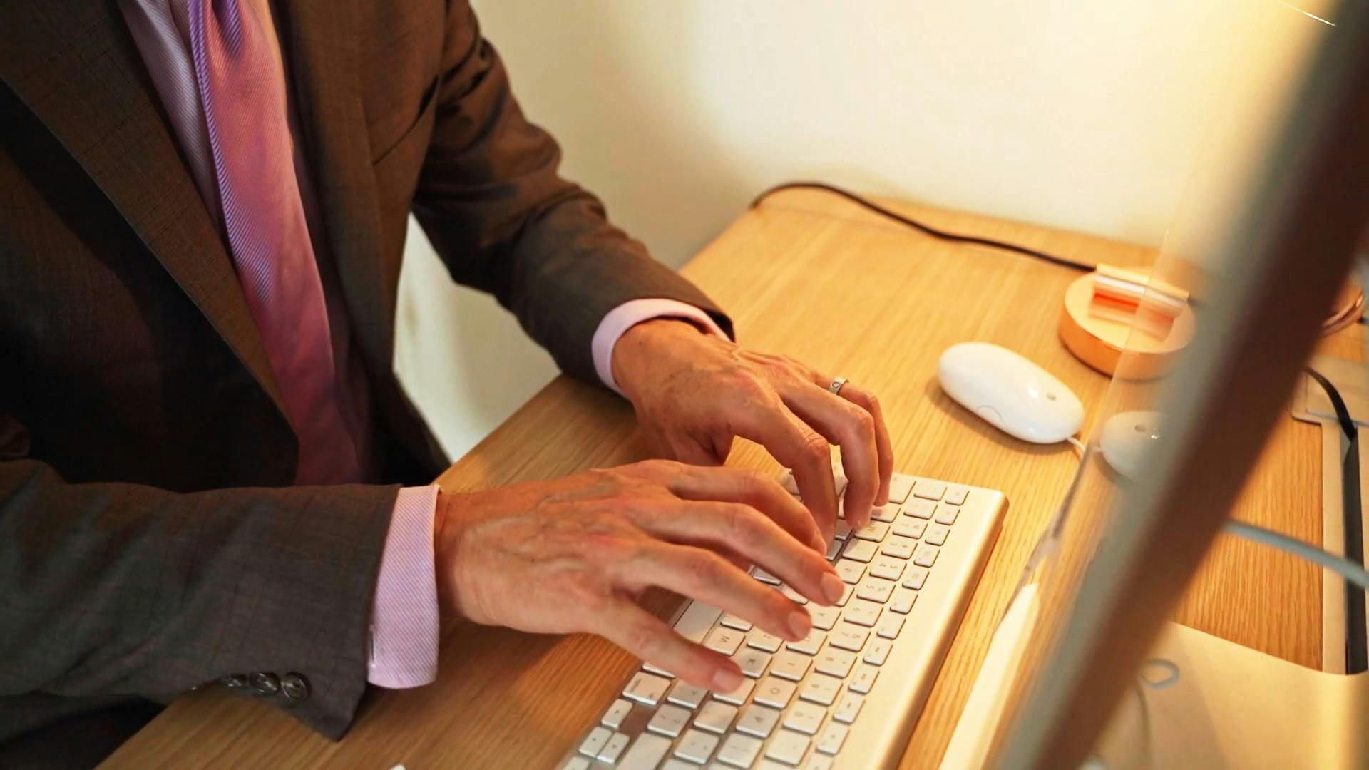 A Business Man Working while using Laptop · Free Stock Video
