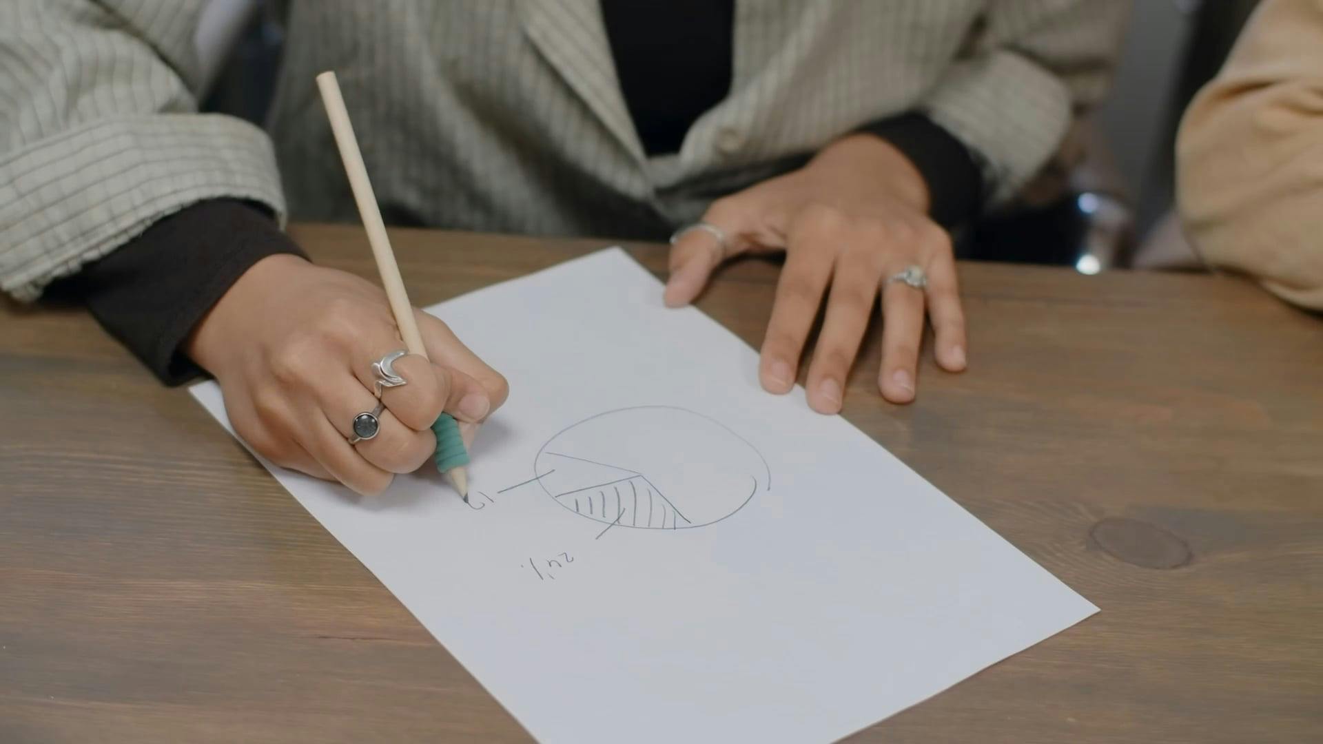 Writing And Erasing On A Sheet Of Paper · Free Stock Video