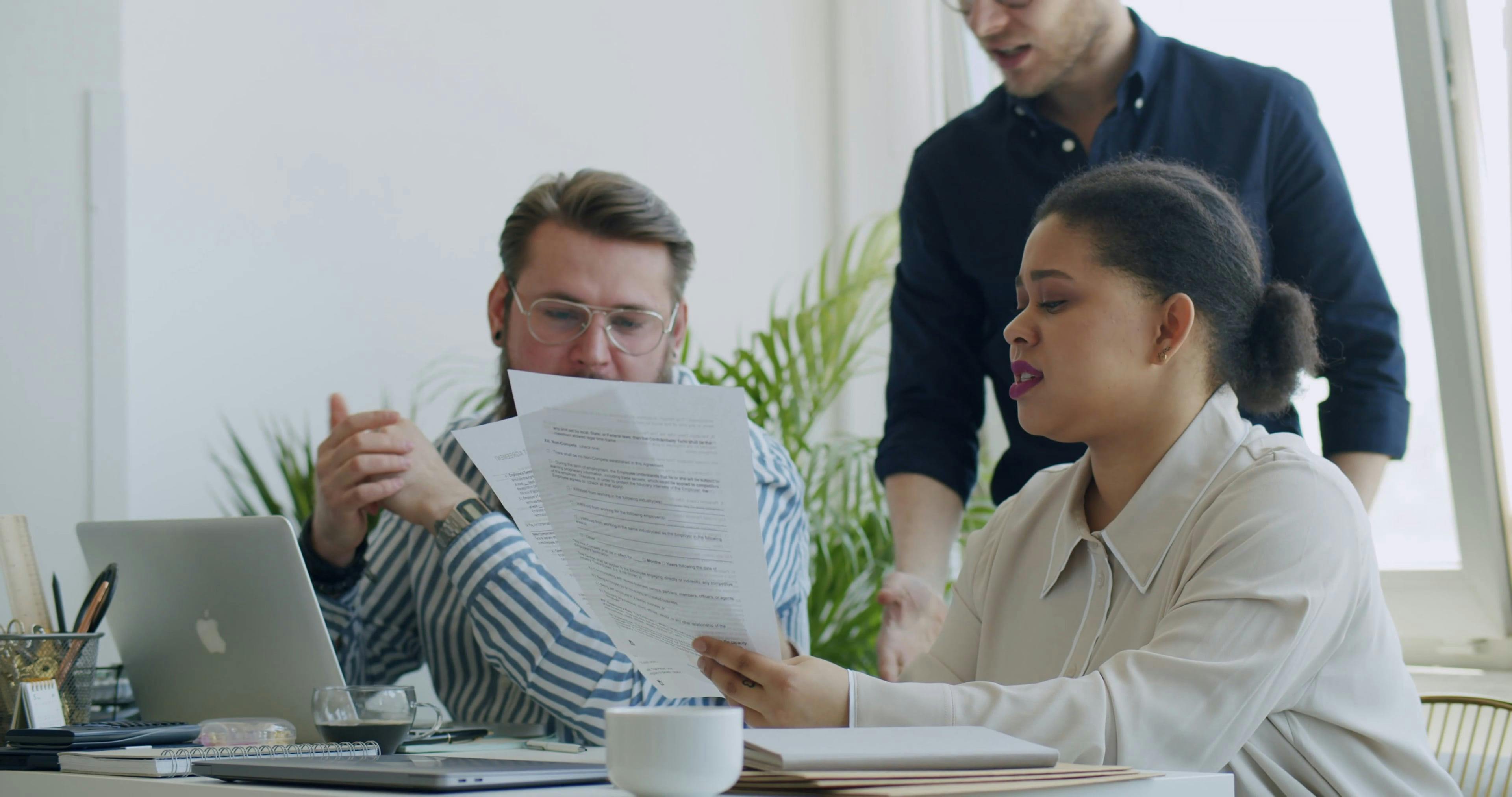 A Man Getting Angry at His Coworkers and Tearing a Paper Free Stock ...