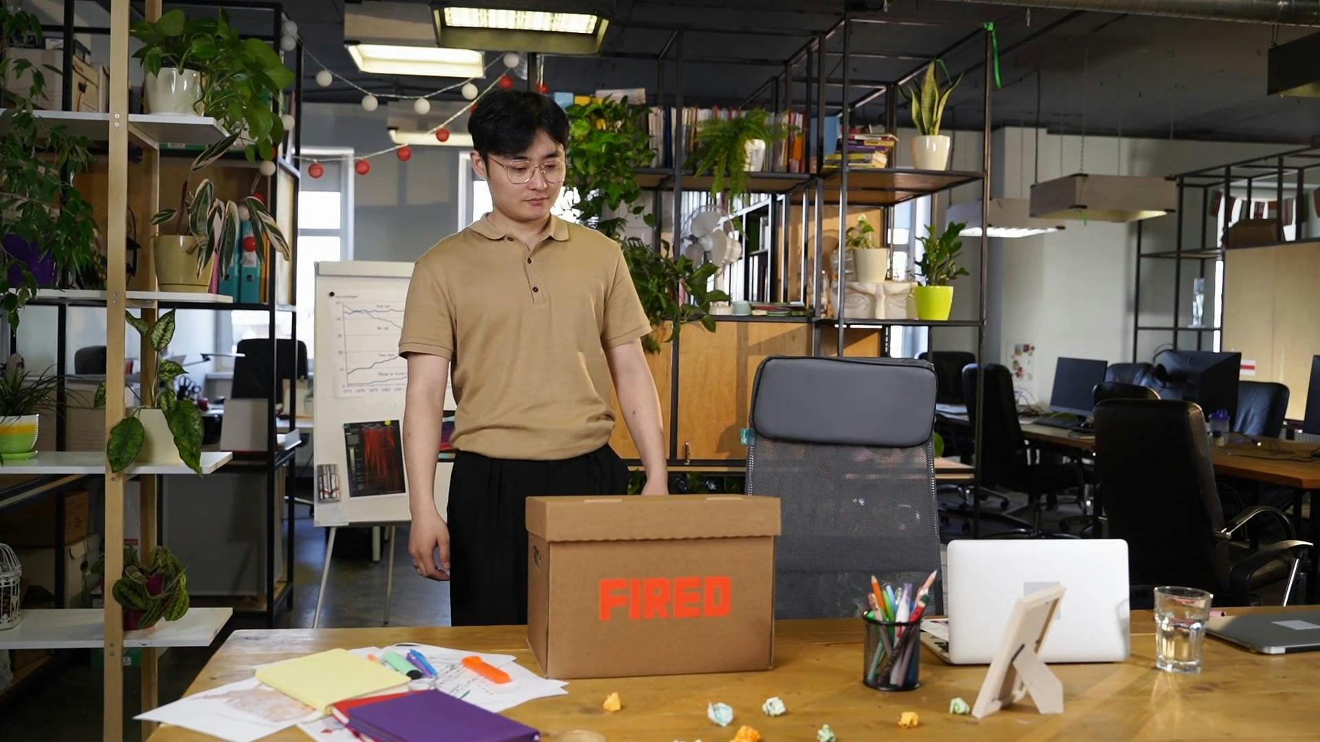 Man Packing His Things In a Box For Being Fired From Work Free Stock ...