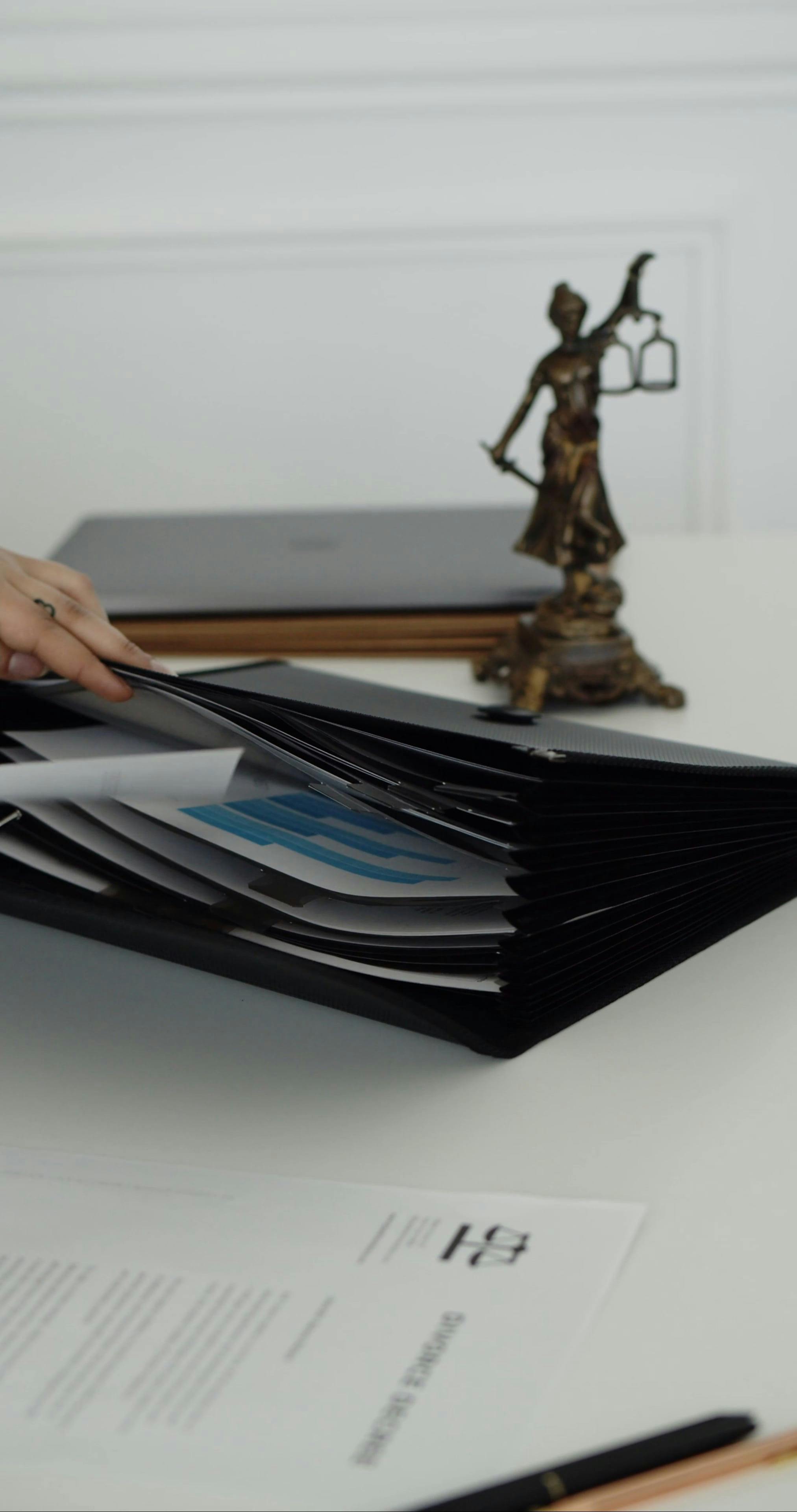 Organized Person Putting Her Paperworks In A Folder Orderly · Free ...