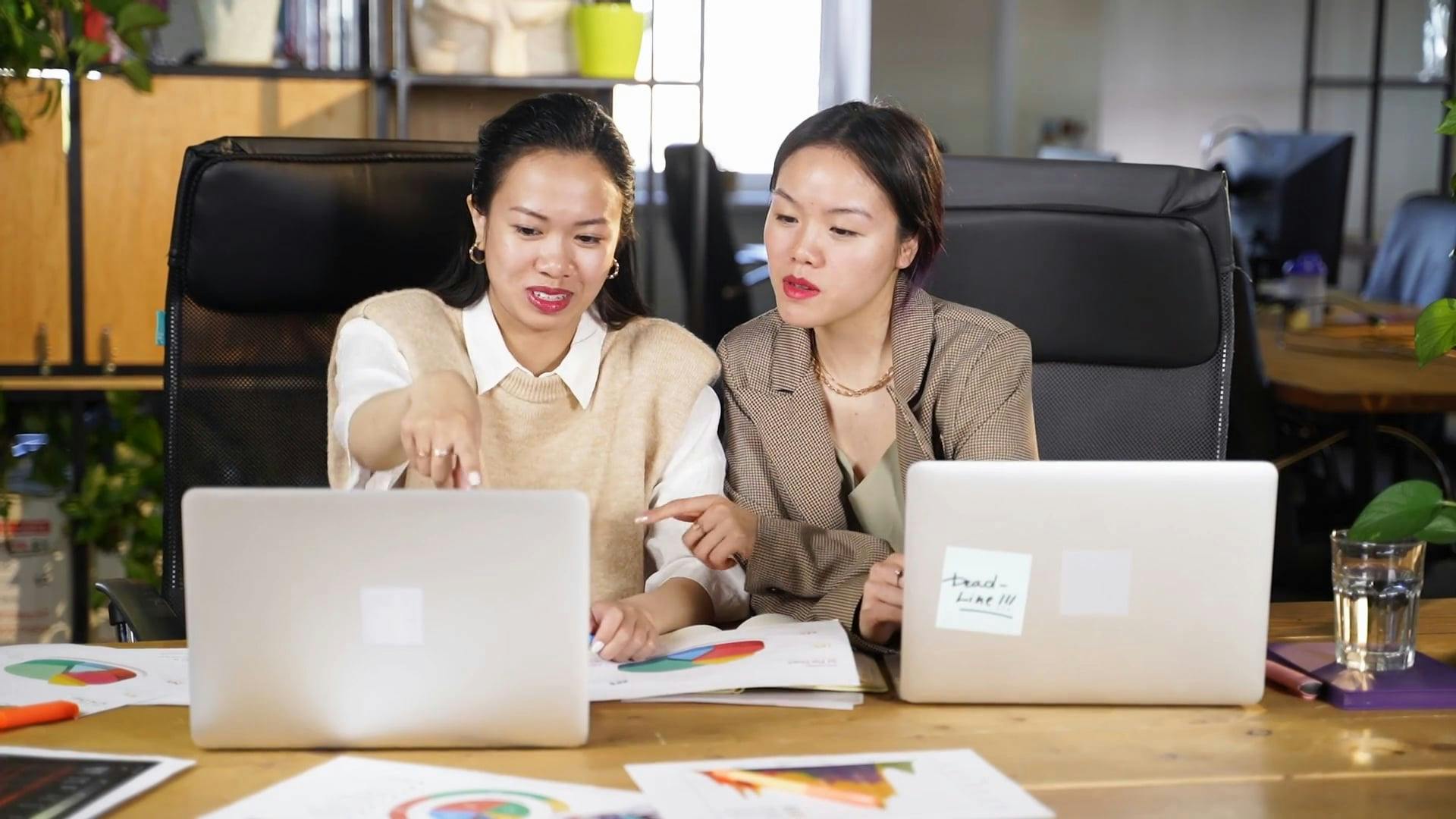 Women Talking While Watching in the Laptop · Free Stock Video
