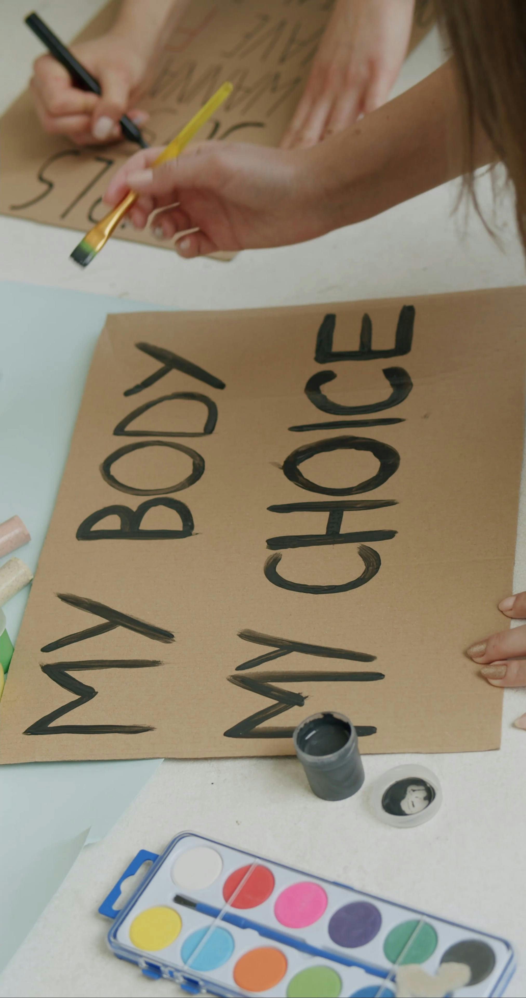 A Person Writing on a Placard Using Paintbrush Free Stock Video Footage ...