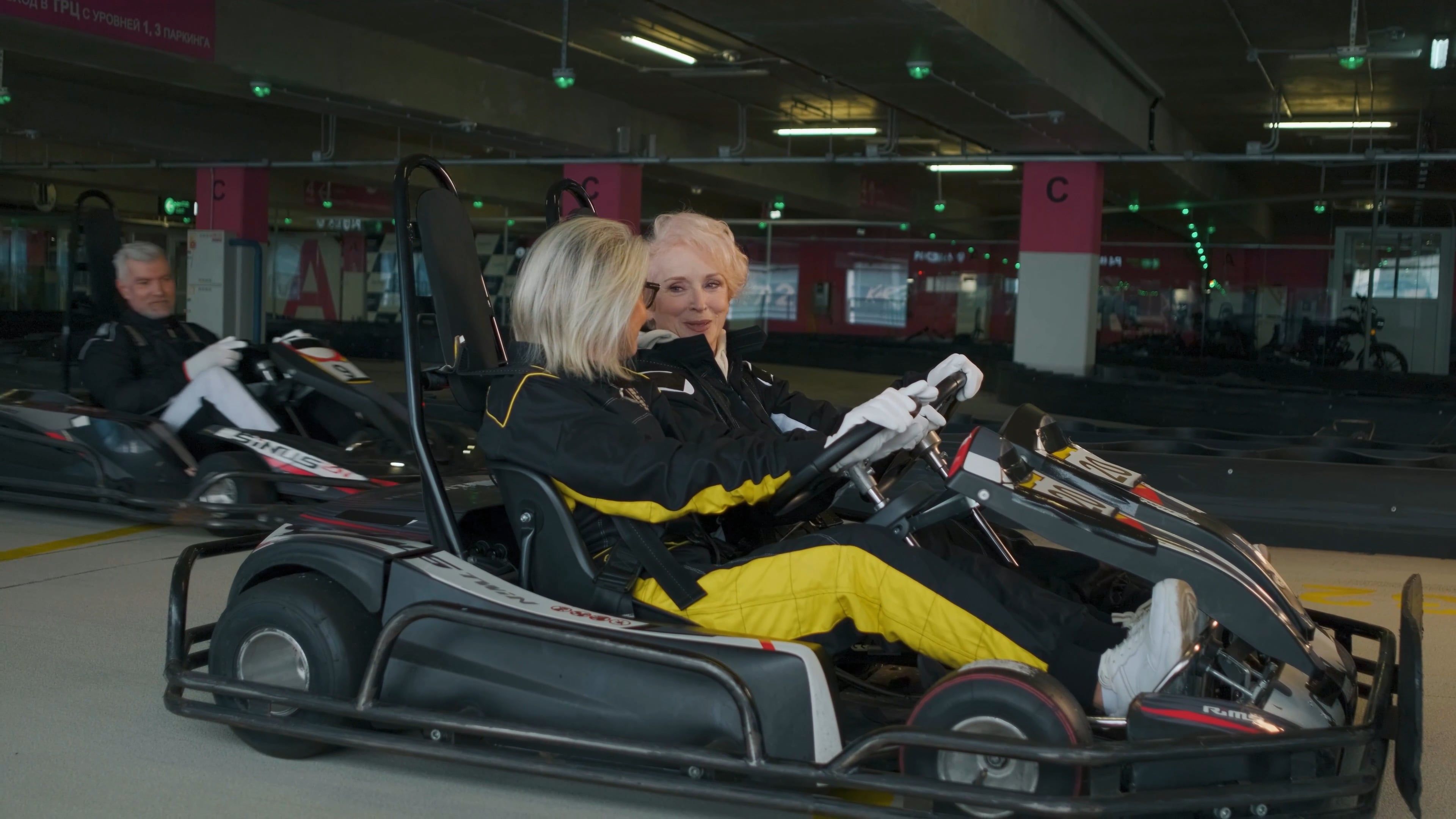 Elderly People Sitting inside Go Karts Talking to Each Other Free Stock ...