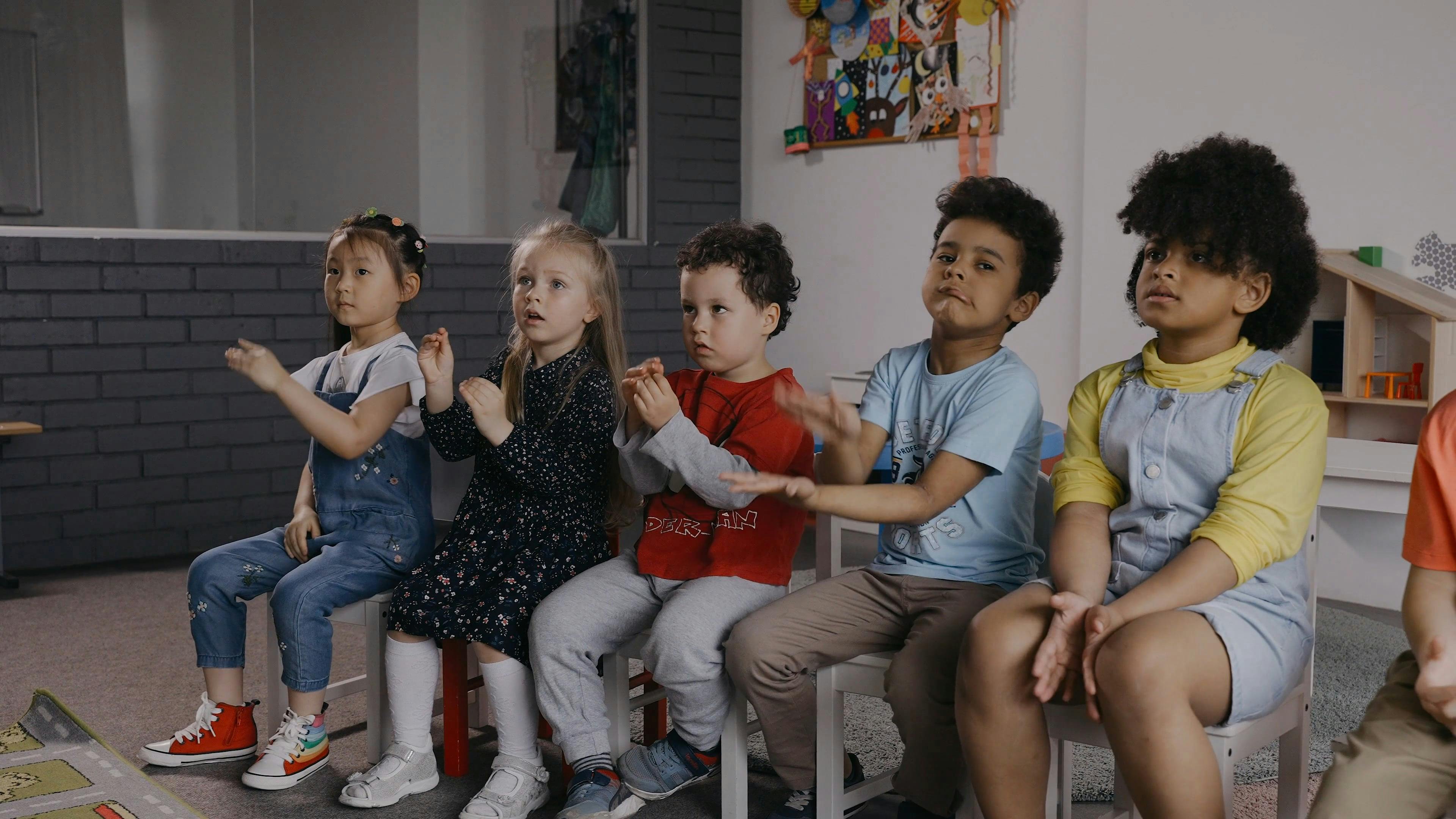 Children Doing an Activity while Sitting on a Chair · Free Stock Video