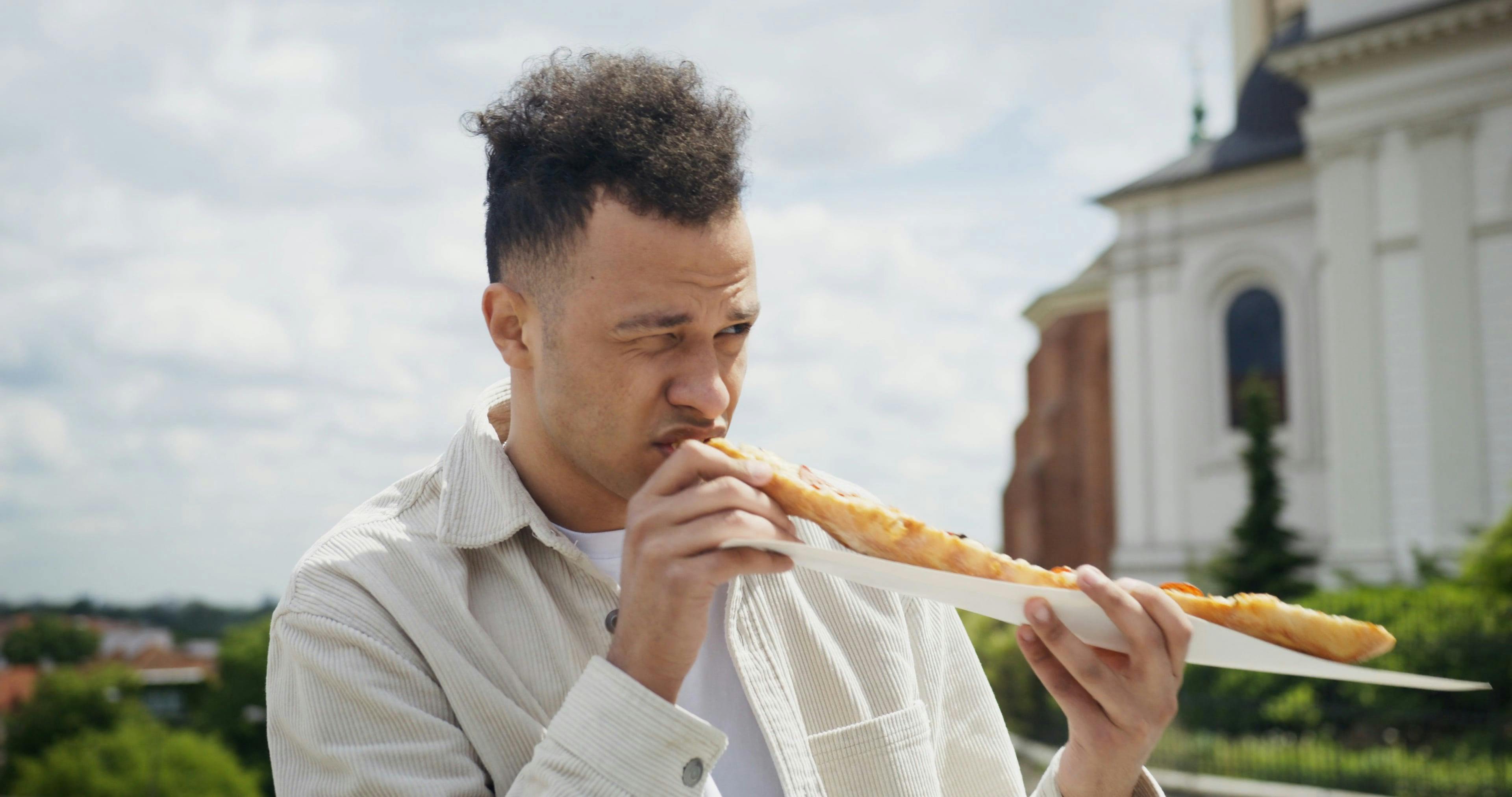 A Man Eating a Bread · Free Stock Video