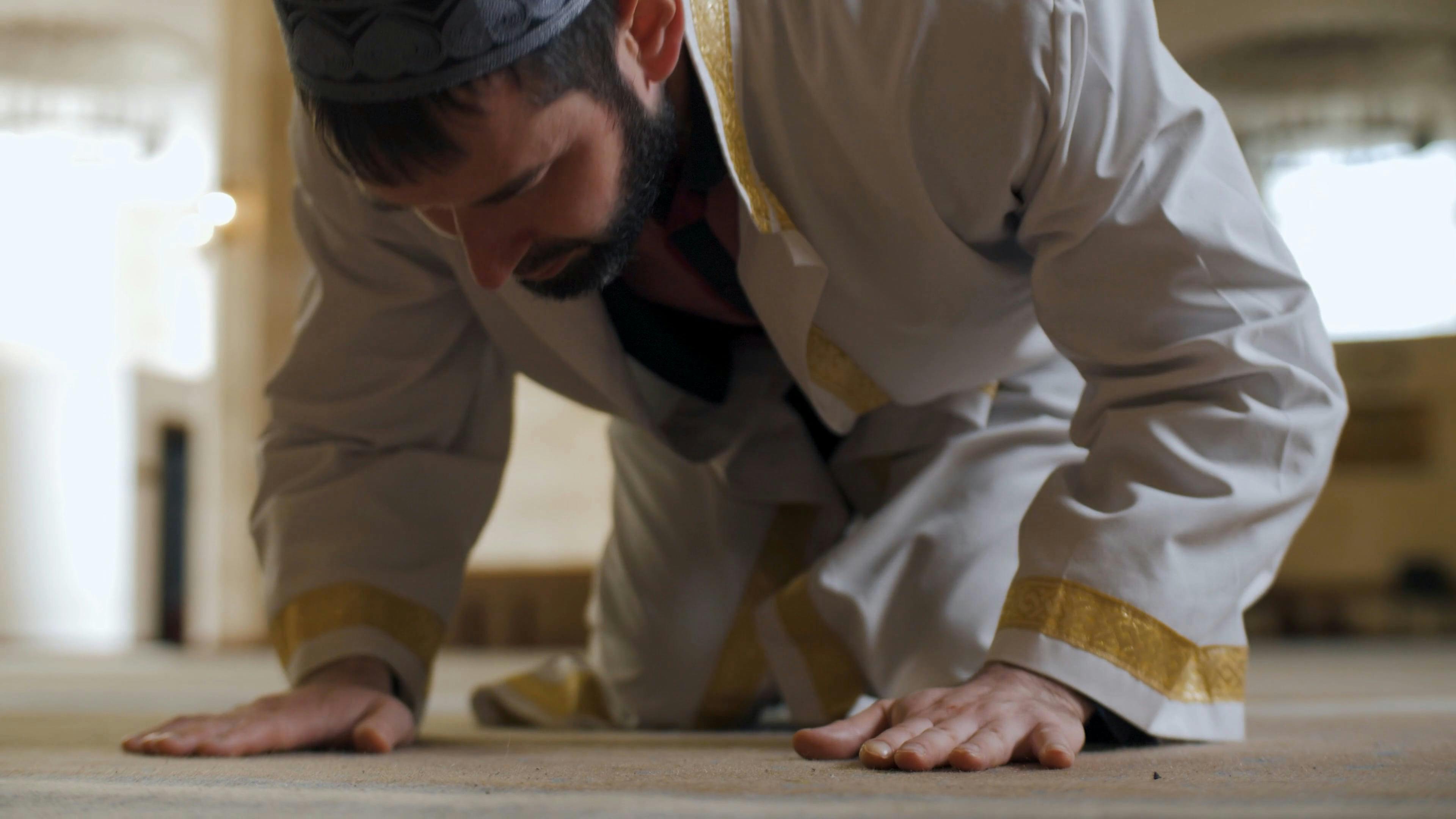 A Man Kneeling and Bowing on the Floor · Free Stock Video