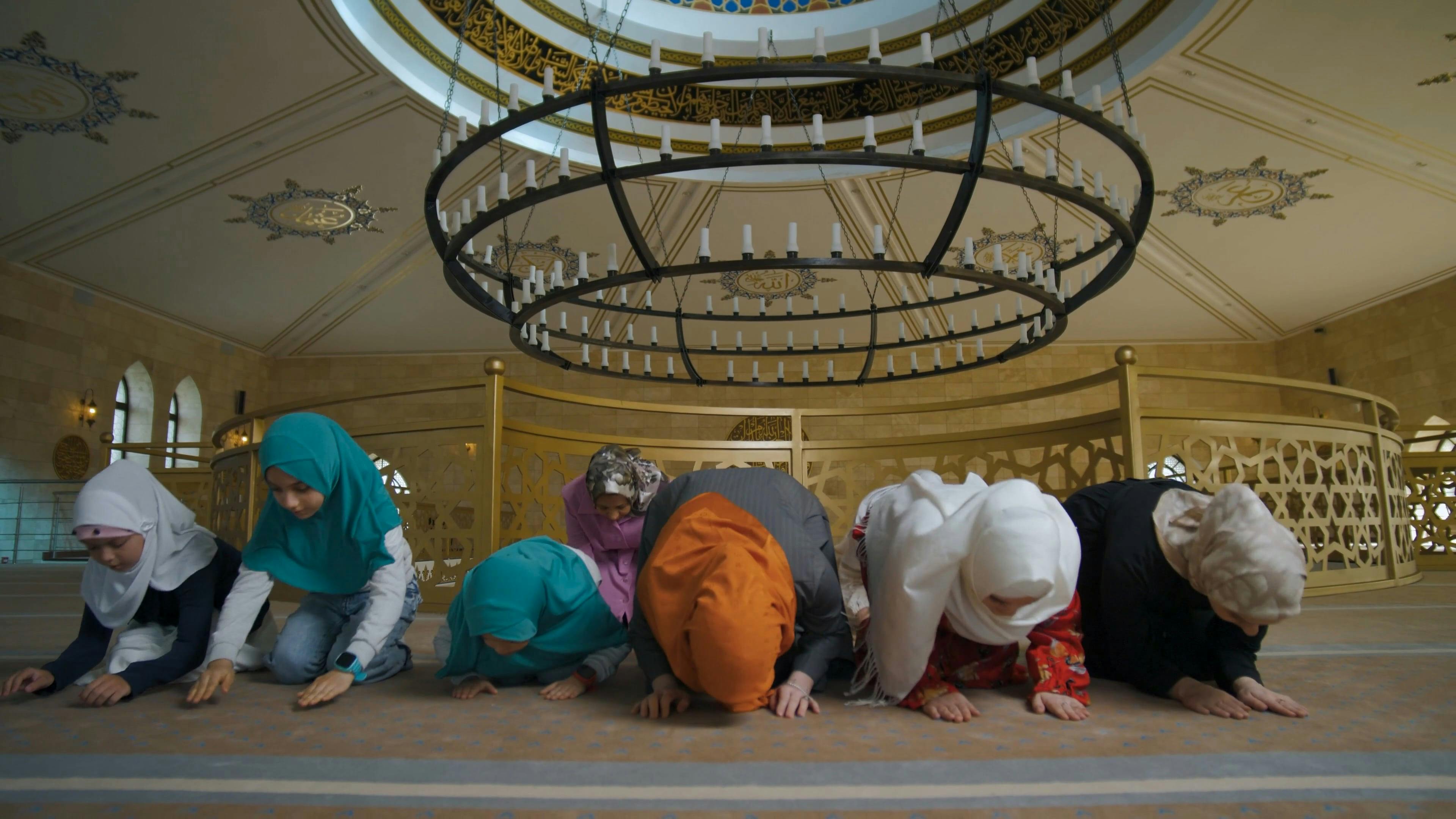 People Bowing Down and Kneeling while Praying · Free Stock Video