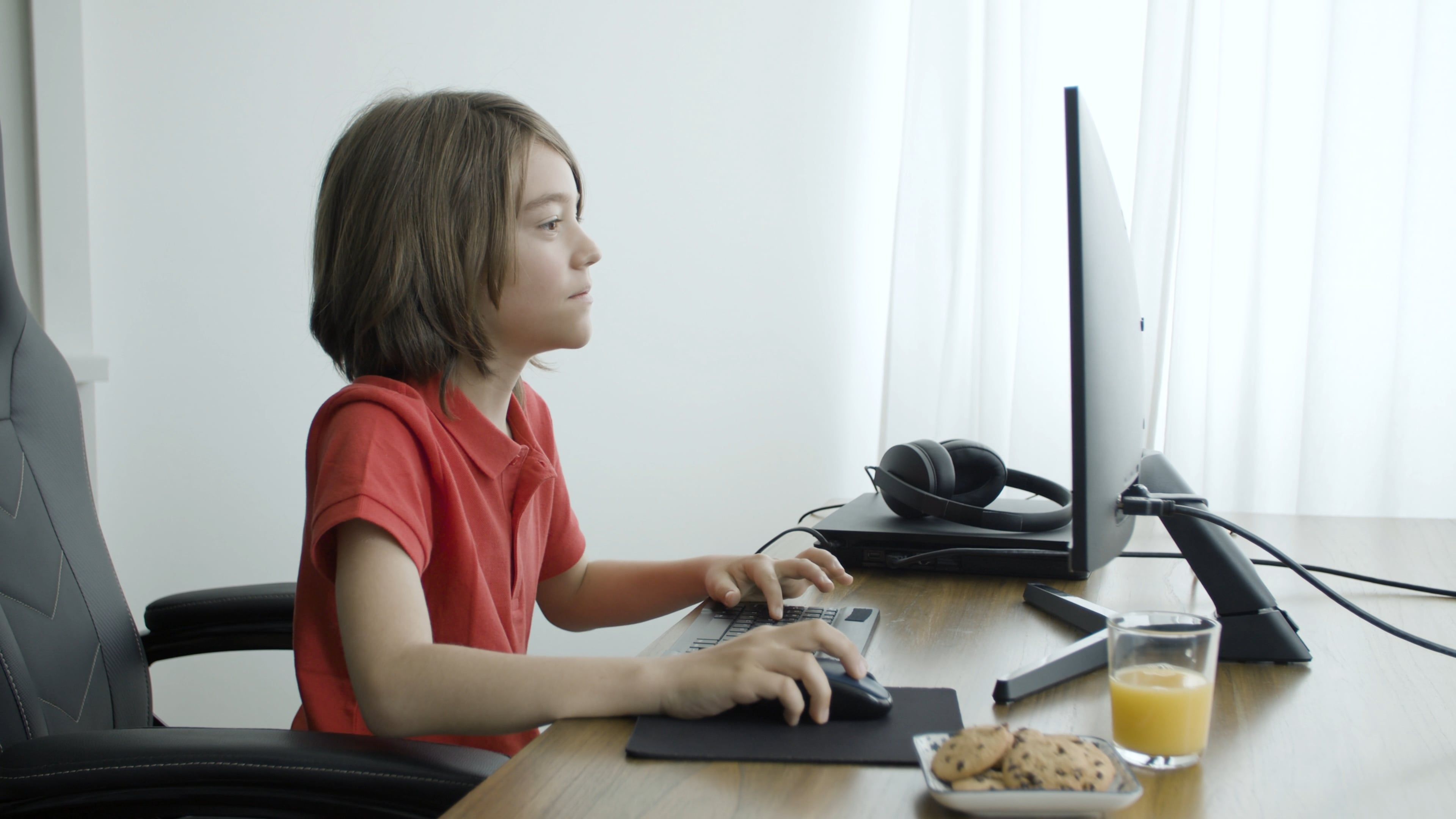 A Child Playing a Video Game on a Computer · Free Stock Video