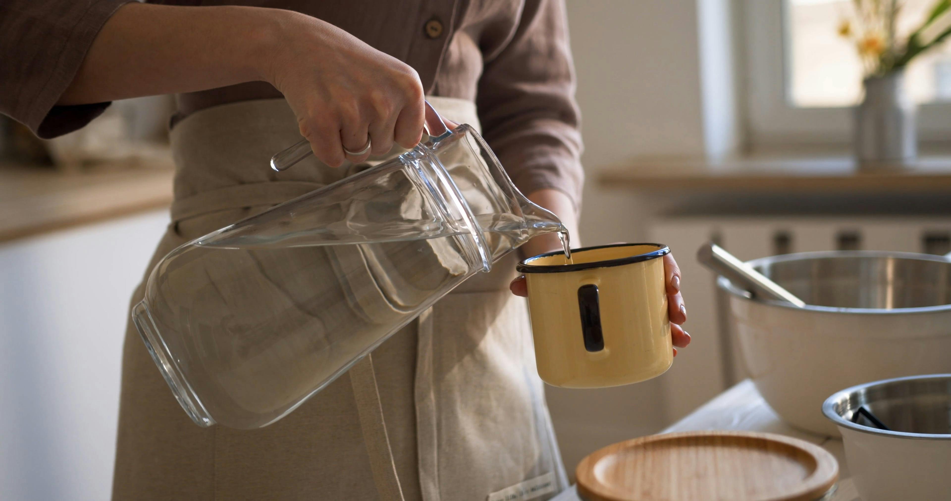 A Woman Pouring water In A Cup · Free Stock Video