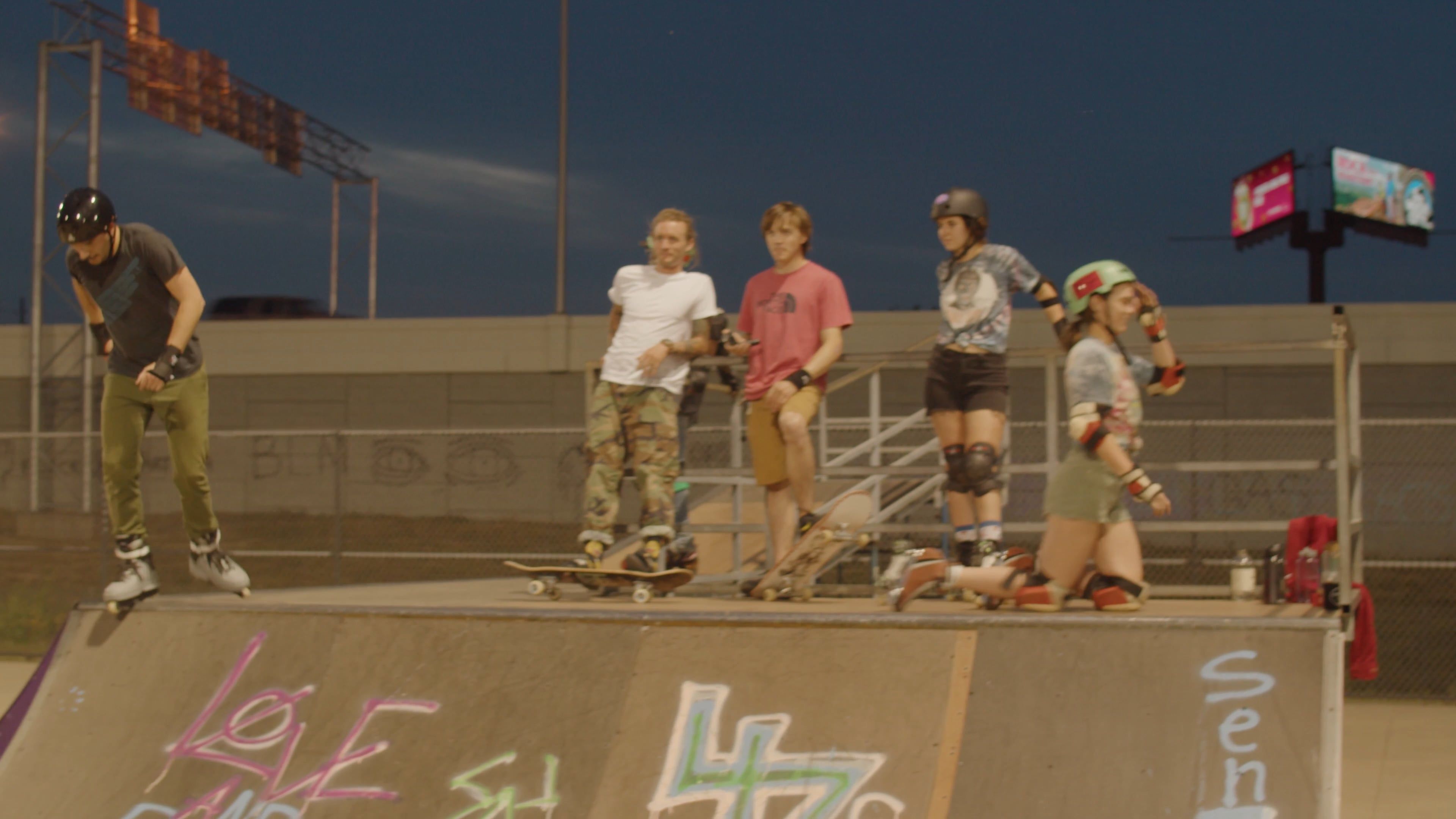 A Man Skating on the Ramp While Other People are Watching · Free Stock ...