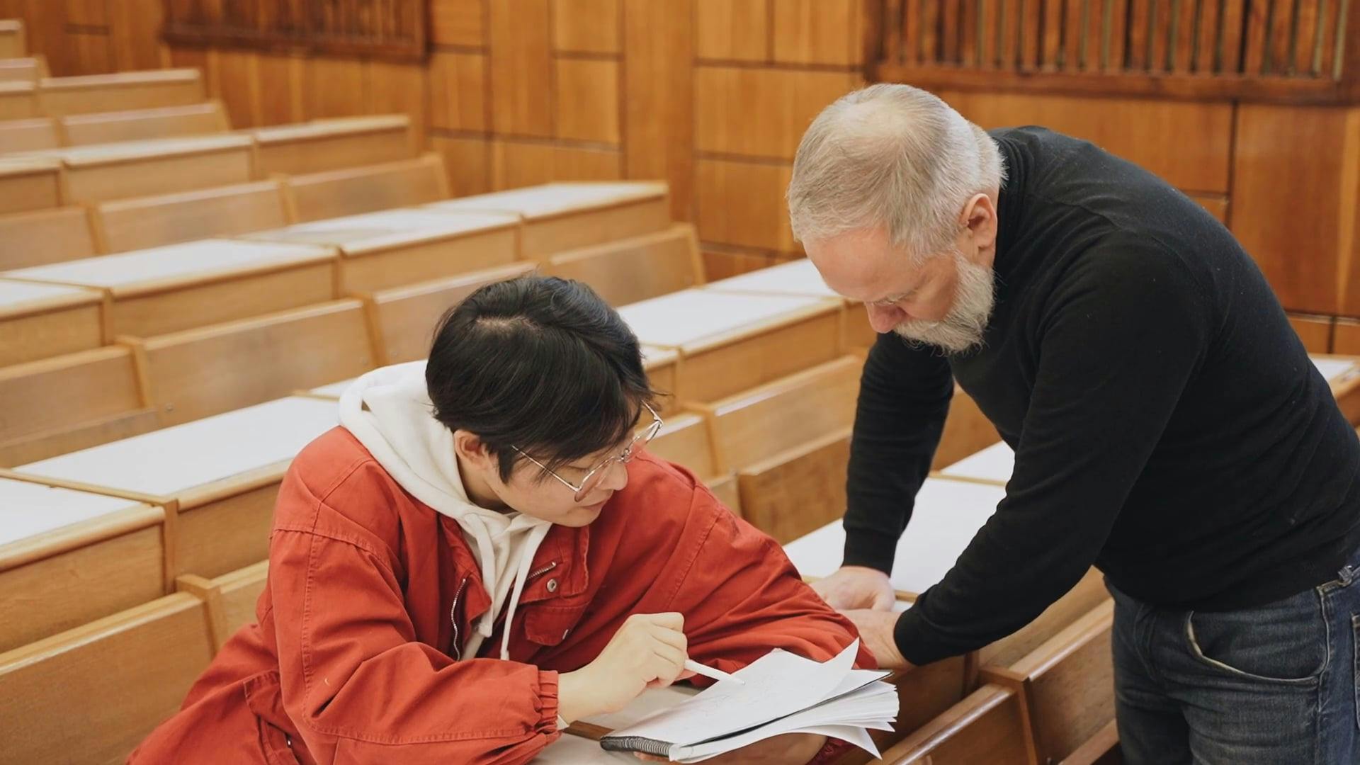 Professor Helping a Student · Free Stock Video