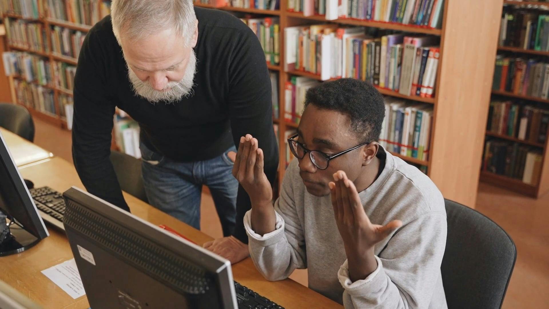 Men Talking while Looking at the Computer Screen · Free Stock Video