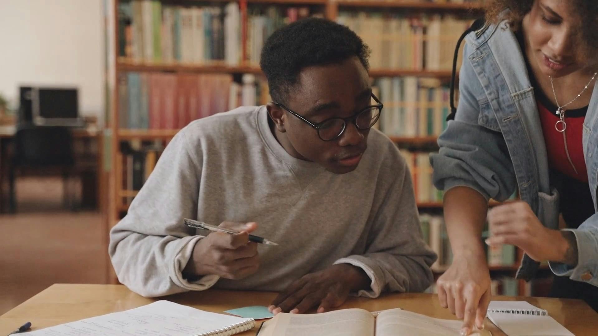 Man and Woman Reading Books and Writing · Free Stock Video